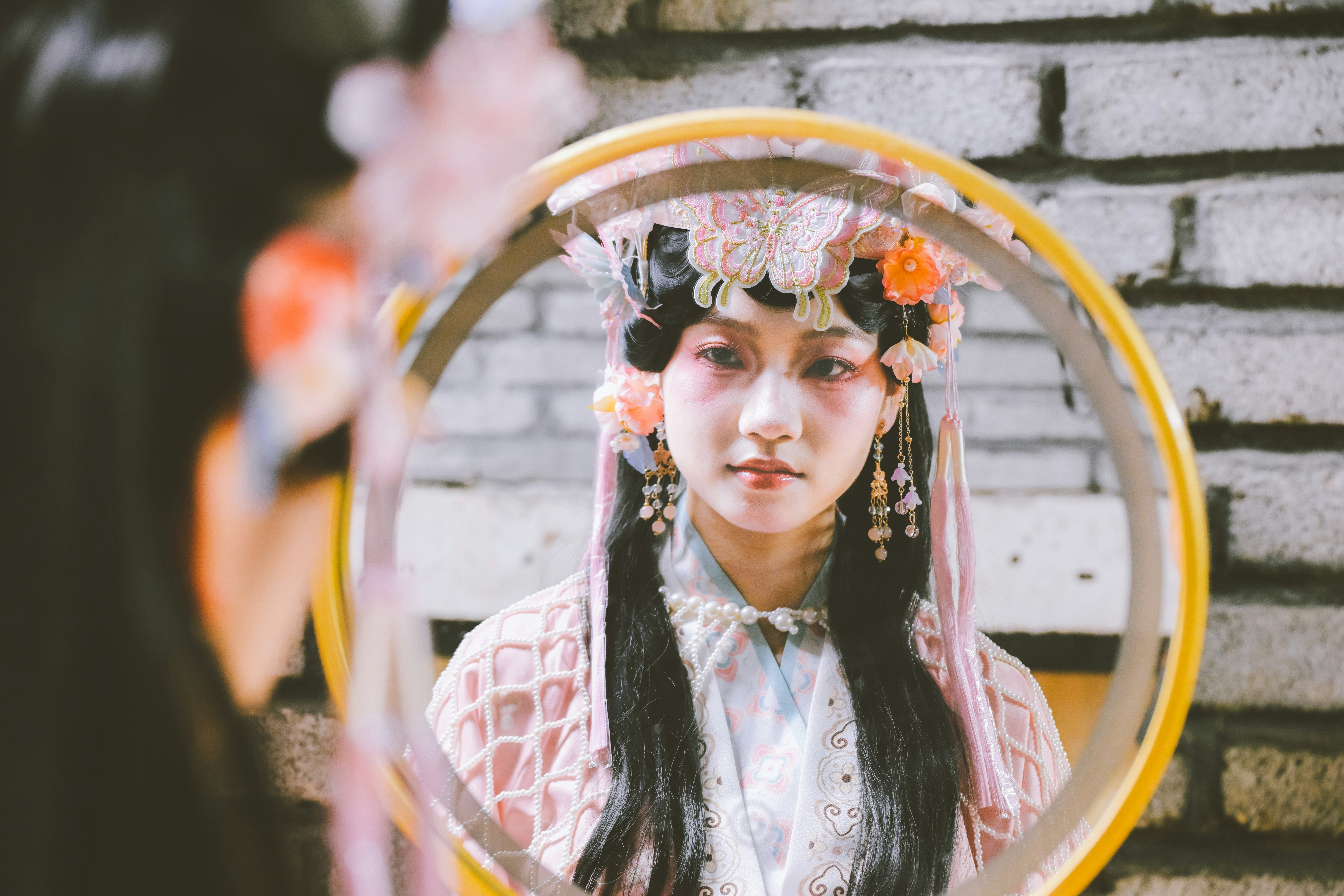 Through the Circular Mirror: Portrait in a Dream of Headdresses