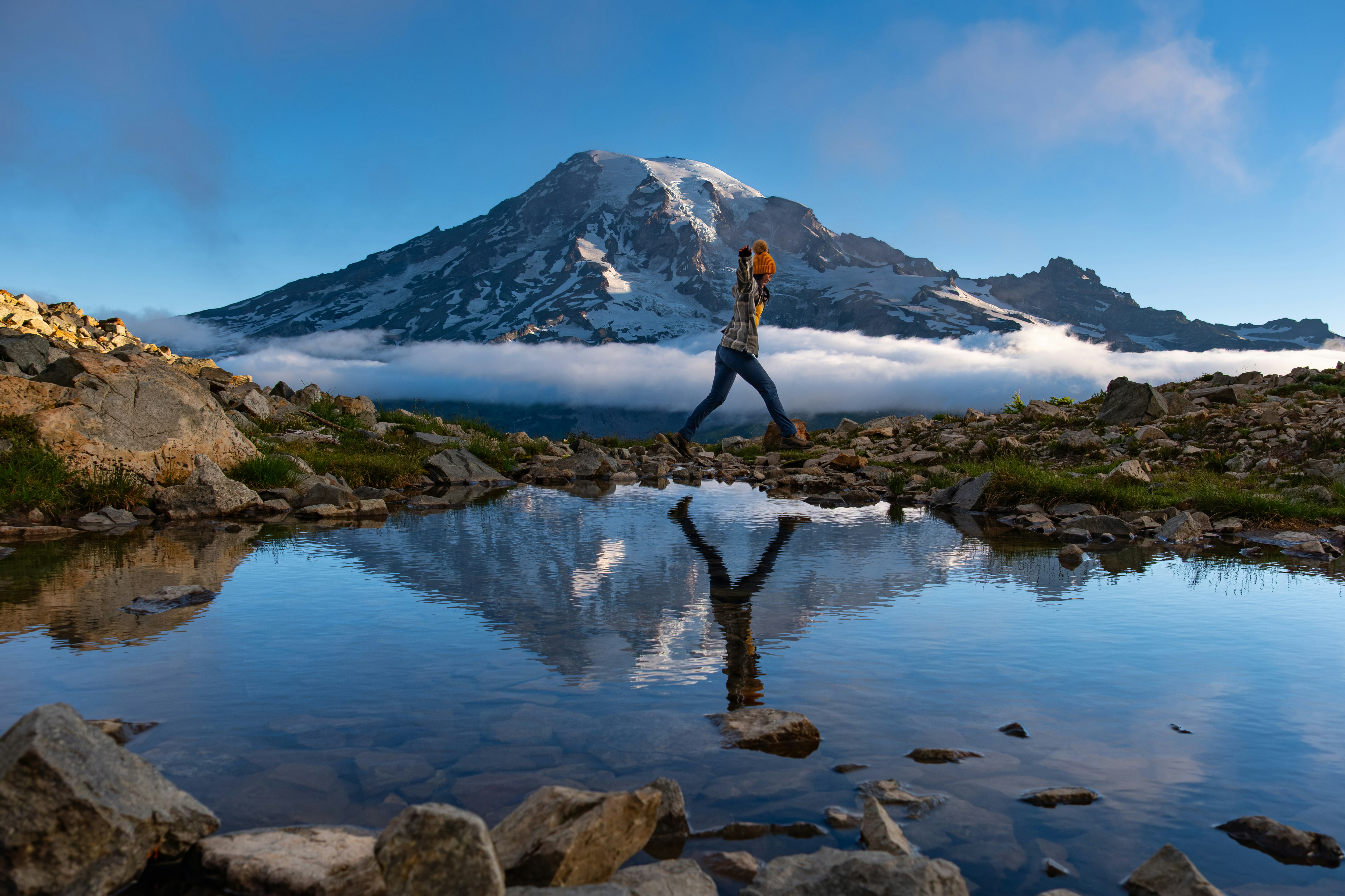 Trail Runner Against a Snowbound Ridge