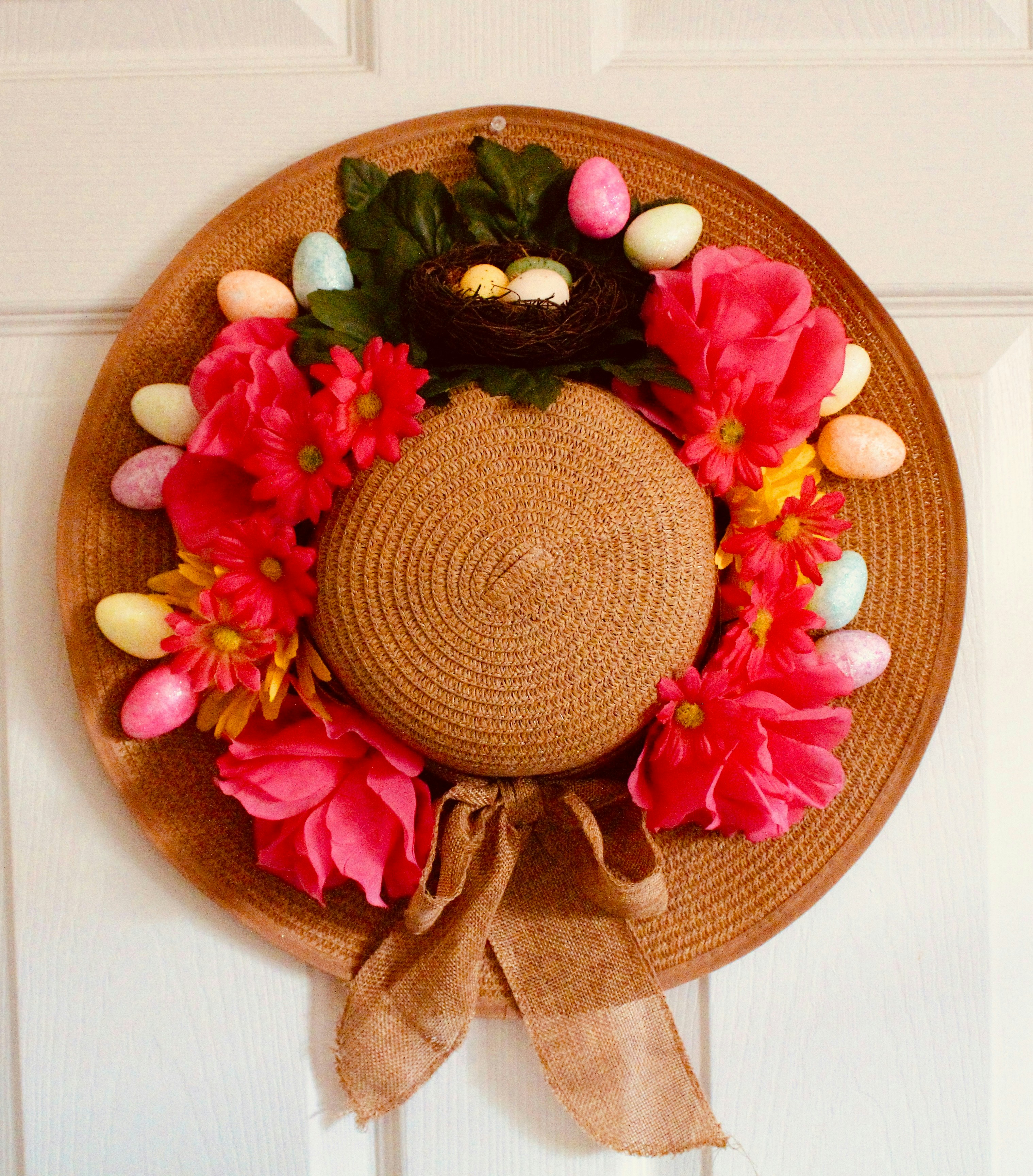 Floral Straw Hat Bloom: A Celebrate-Spring Wreath on a White Door