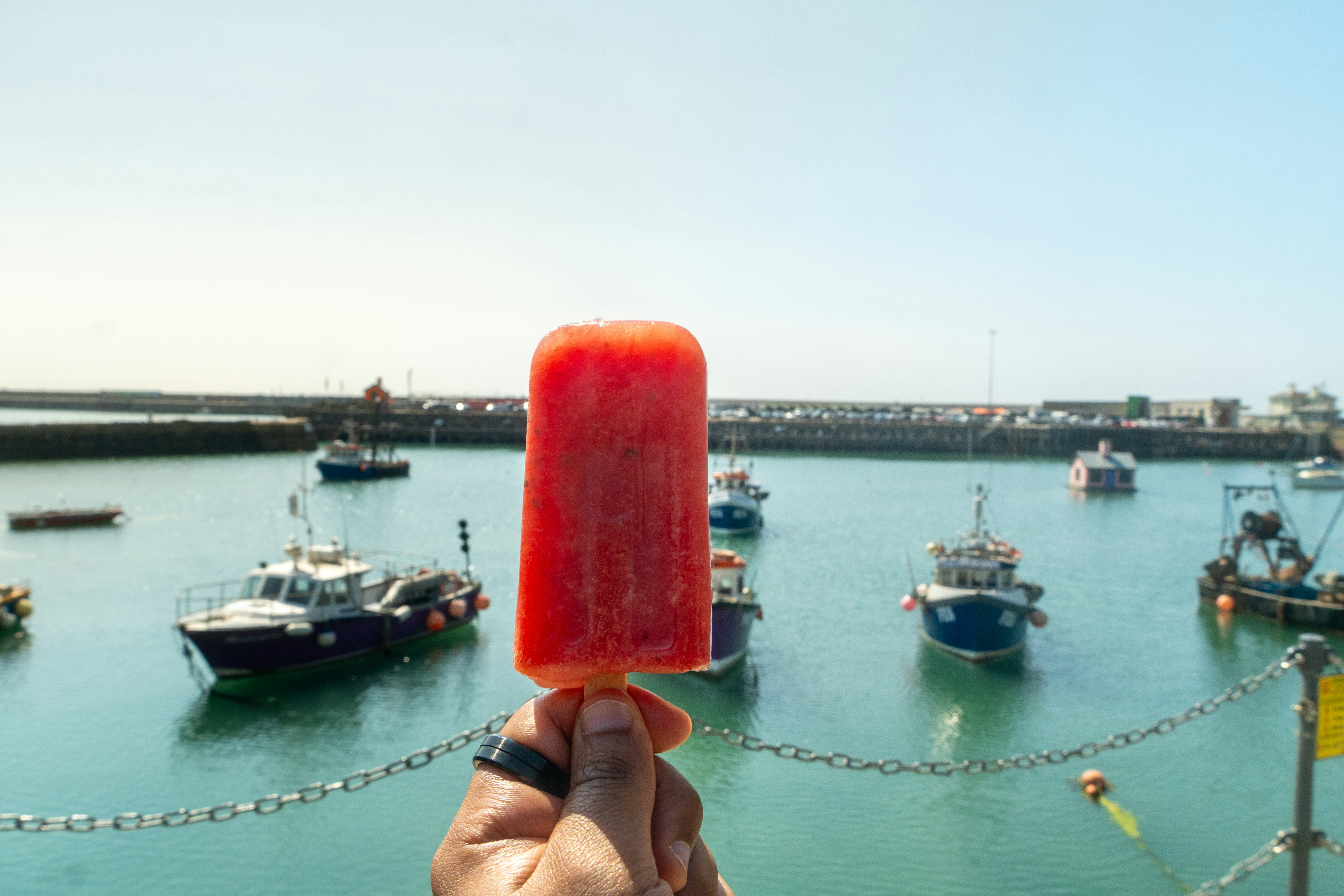Red Popsicle, Calm Harbor: A Portrait in Bright Summer Light