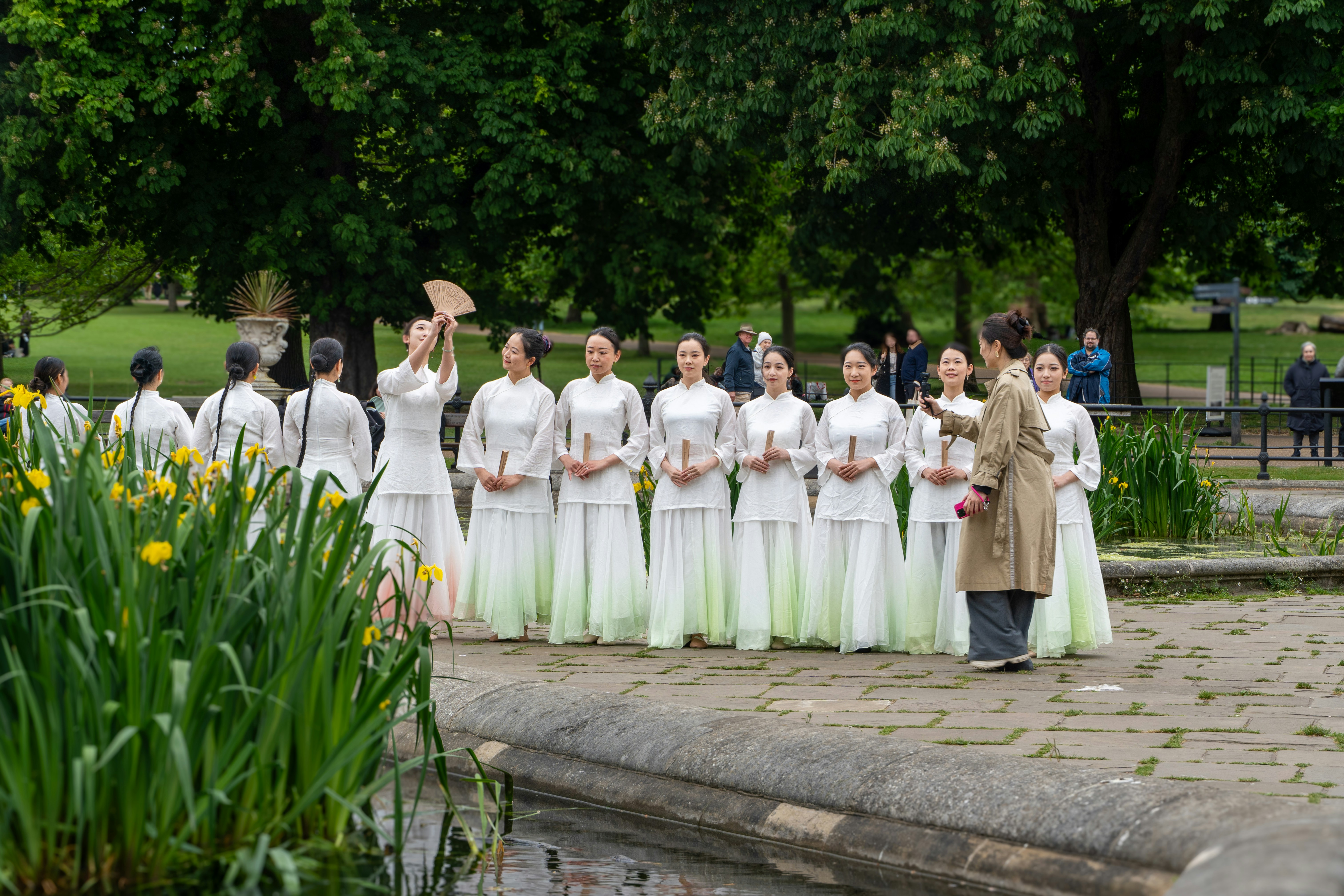 Chorus of White-Gowned Dancers by the Park Pond