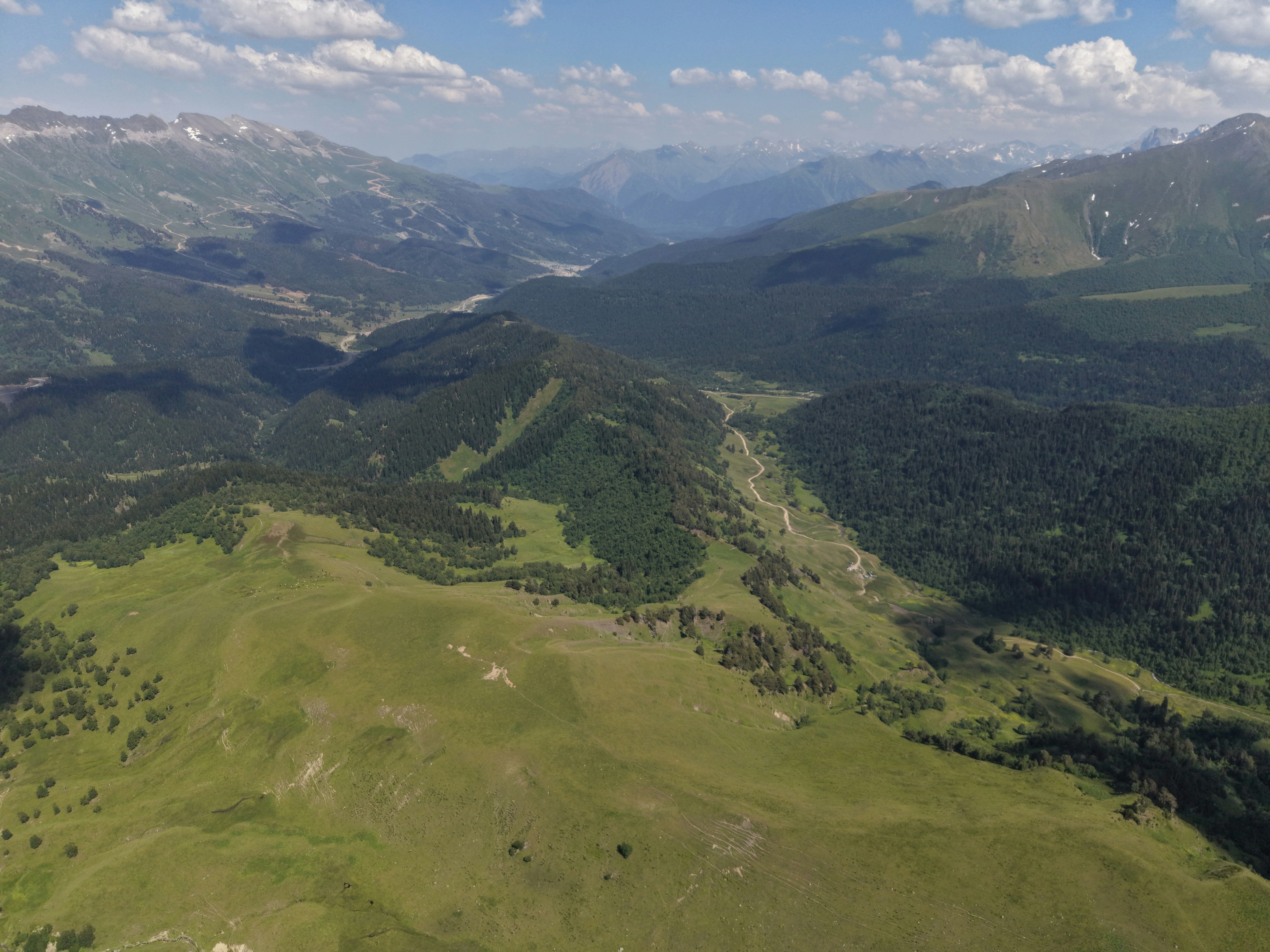 Valley Ribbon: Aerial Span Through Alpine Valleys