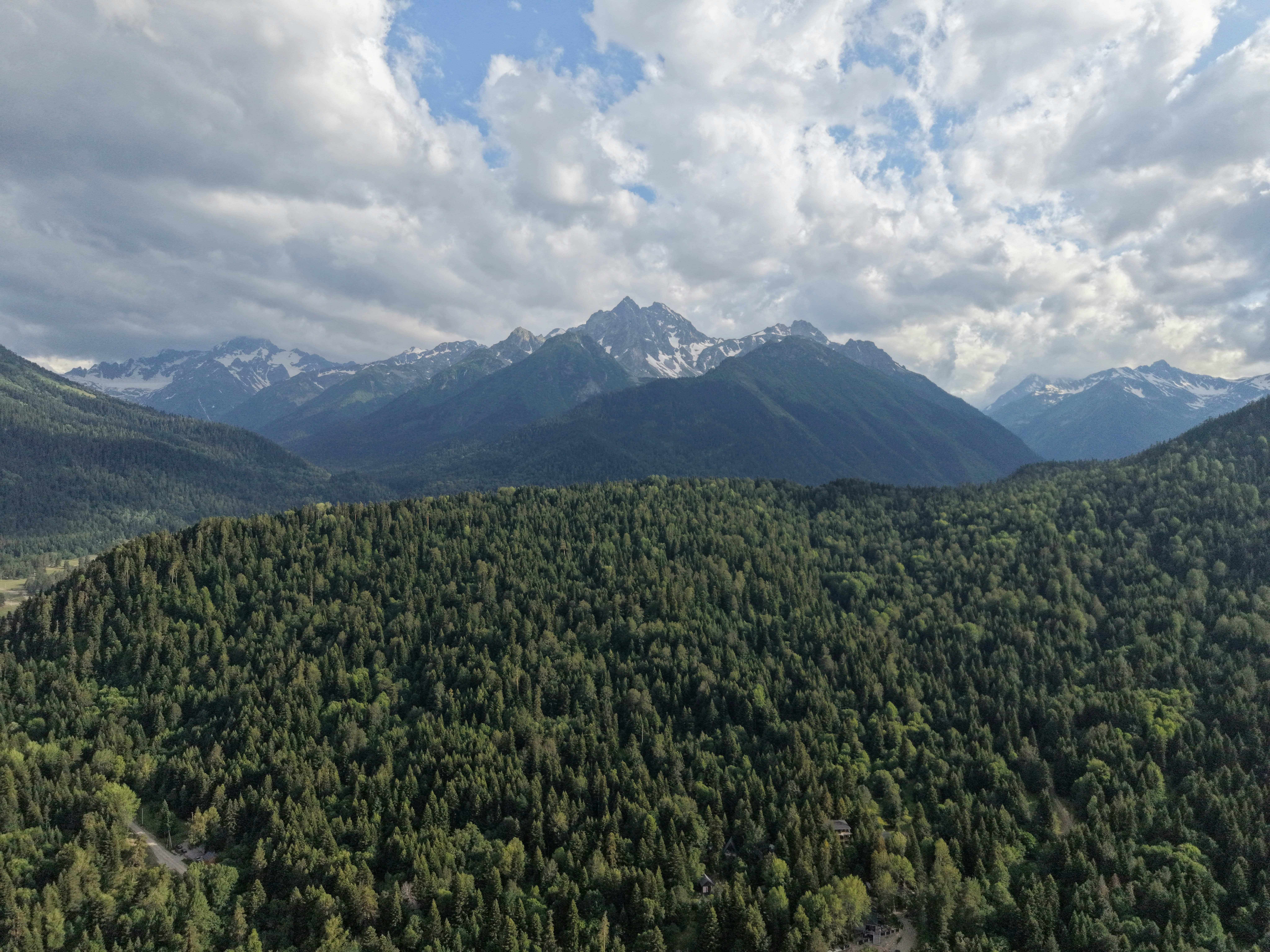 Grand Ridge Under Cloudlit Peaks