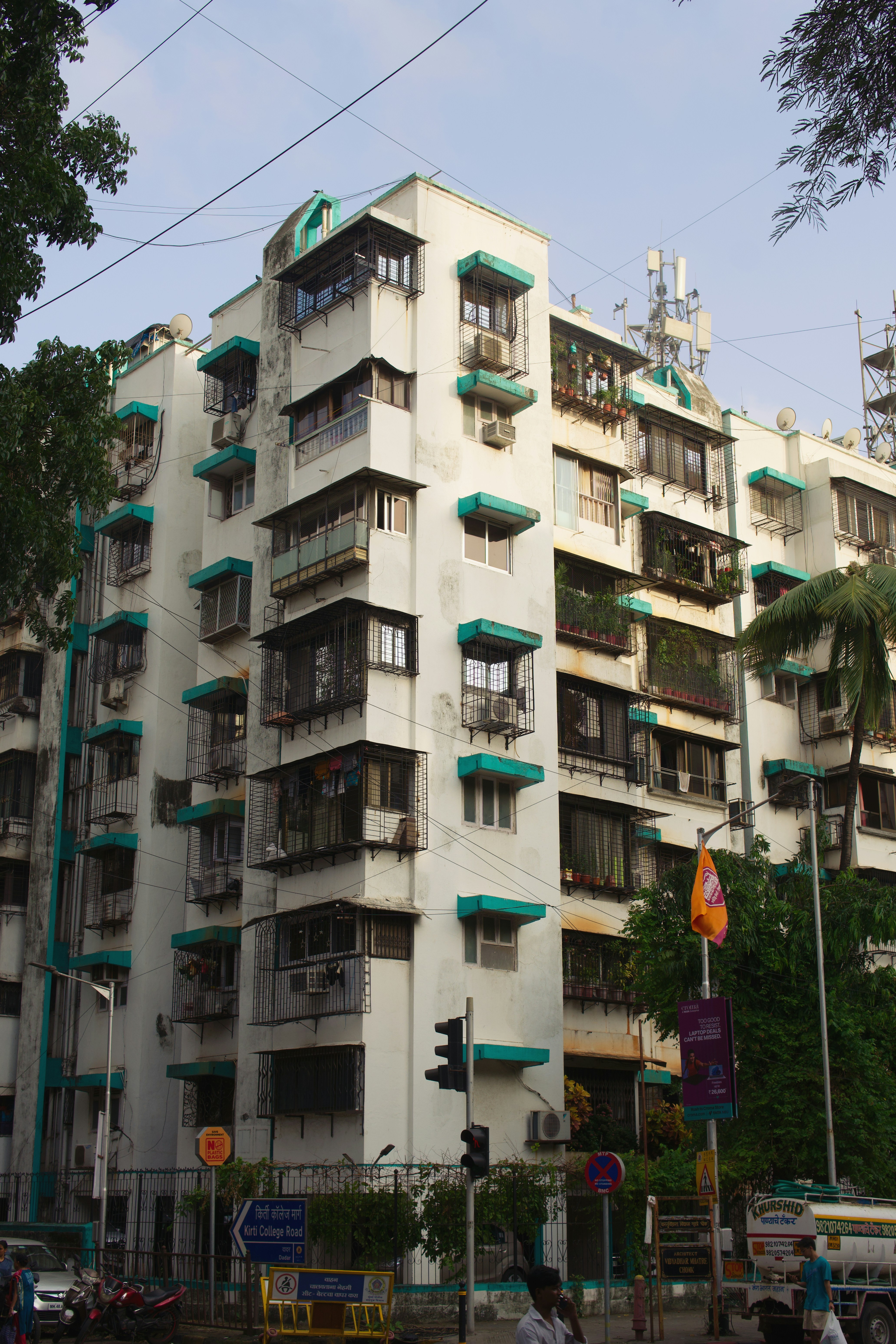 Teal Canopies on a Sunlit Urban Residence