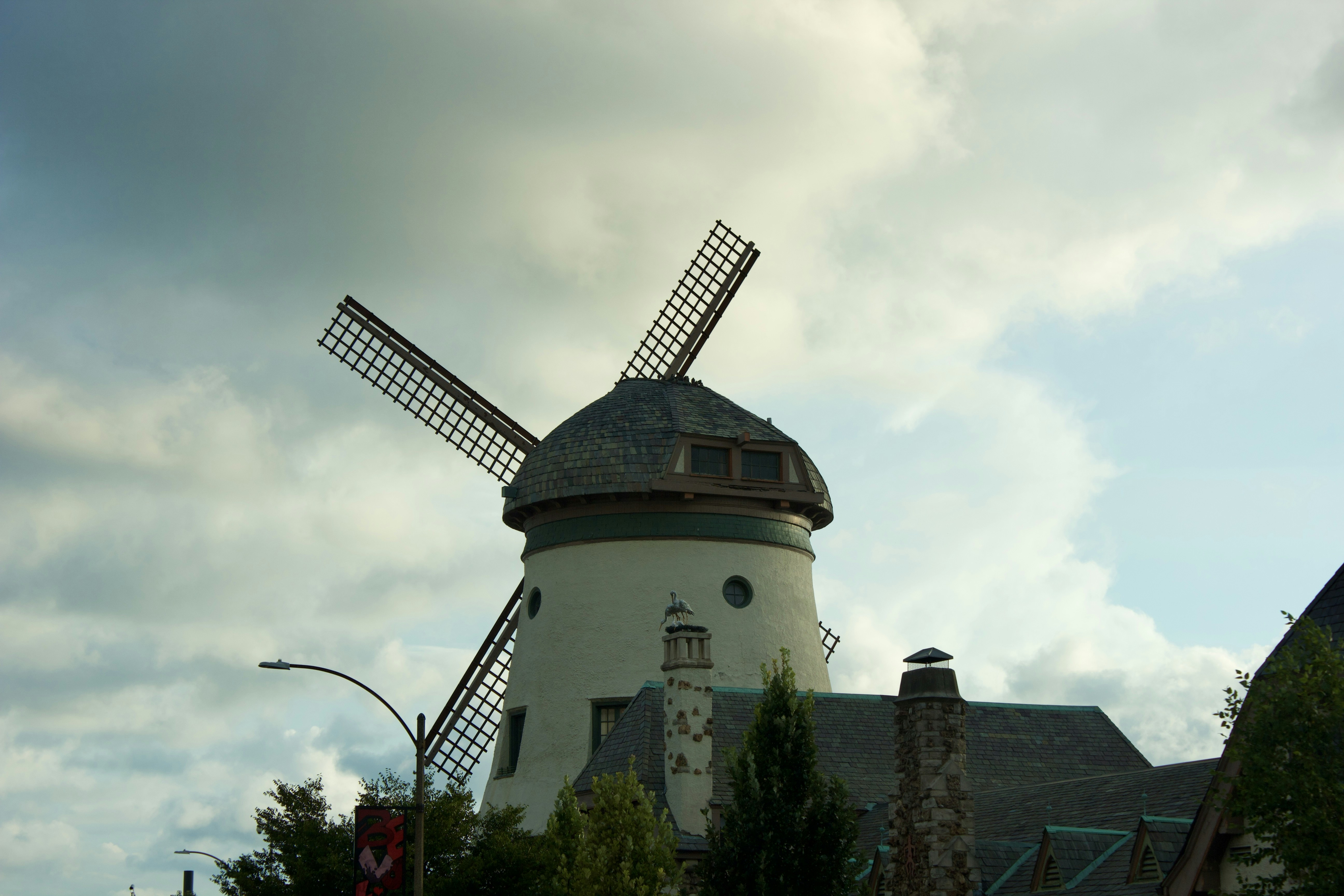 Windmill Sentinel: A Static Giant Over the Rooftops