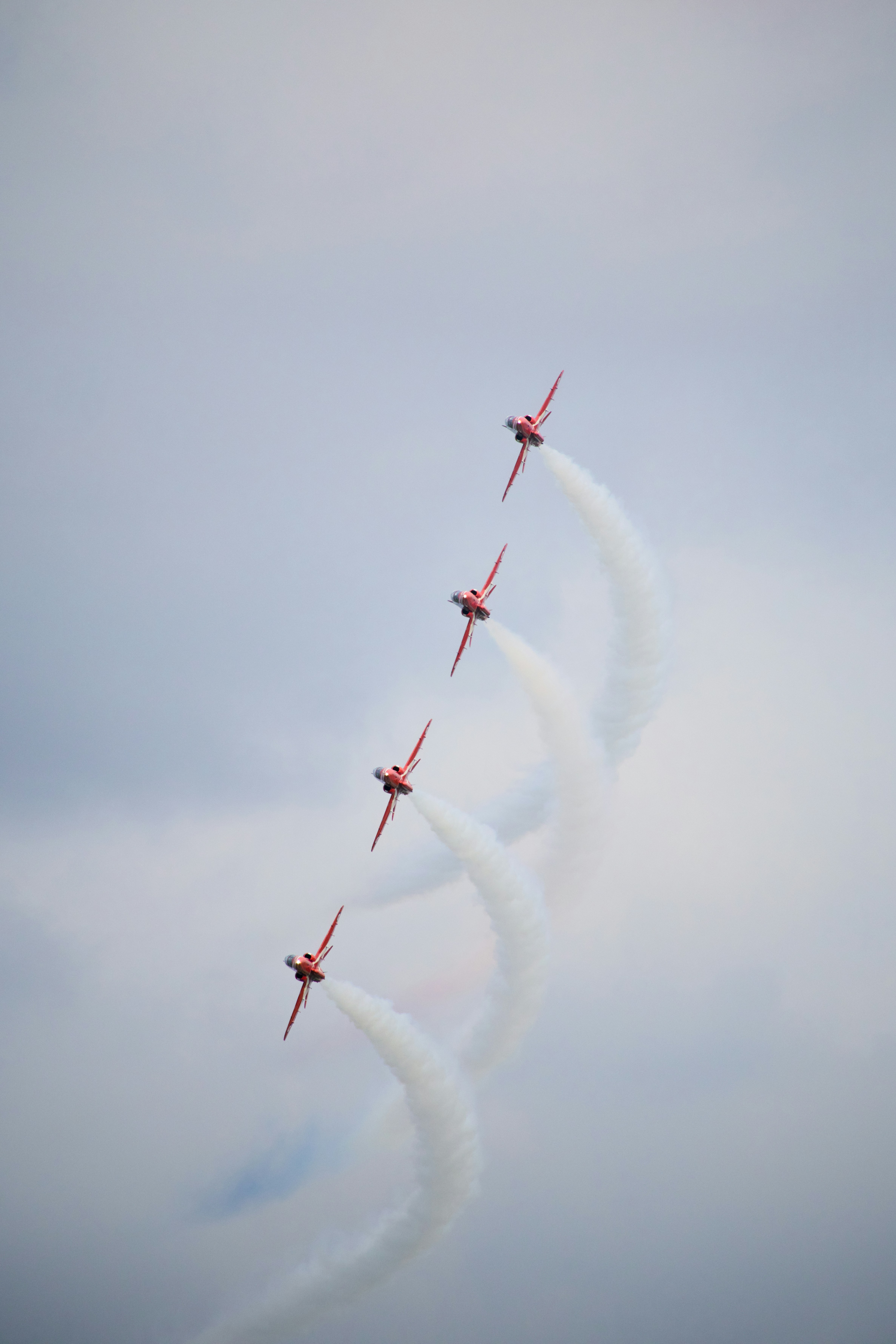 Red Flight in Symmetrical Arc: A Quartet of Smoke Trails