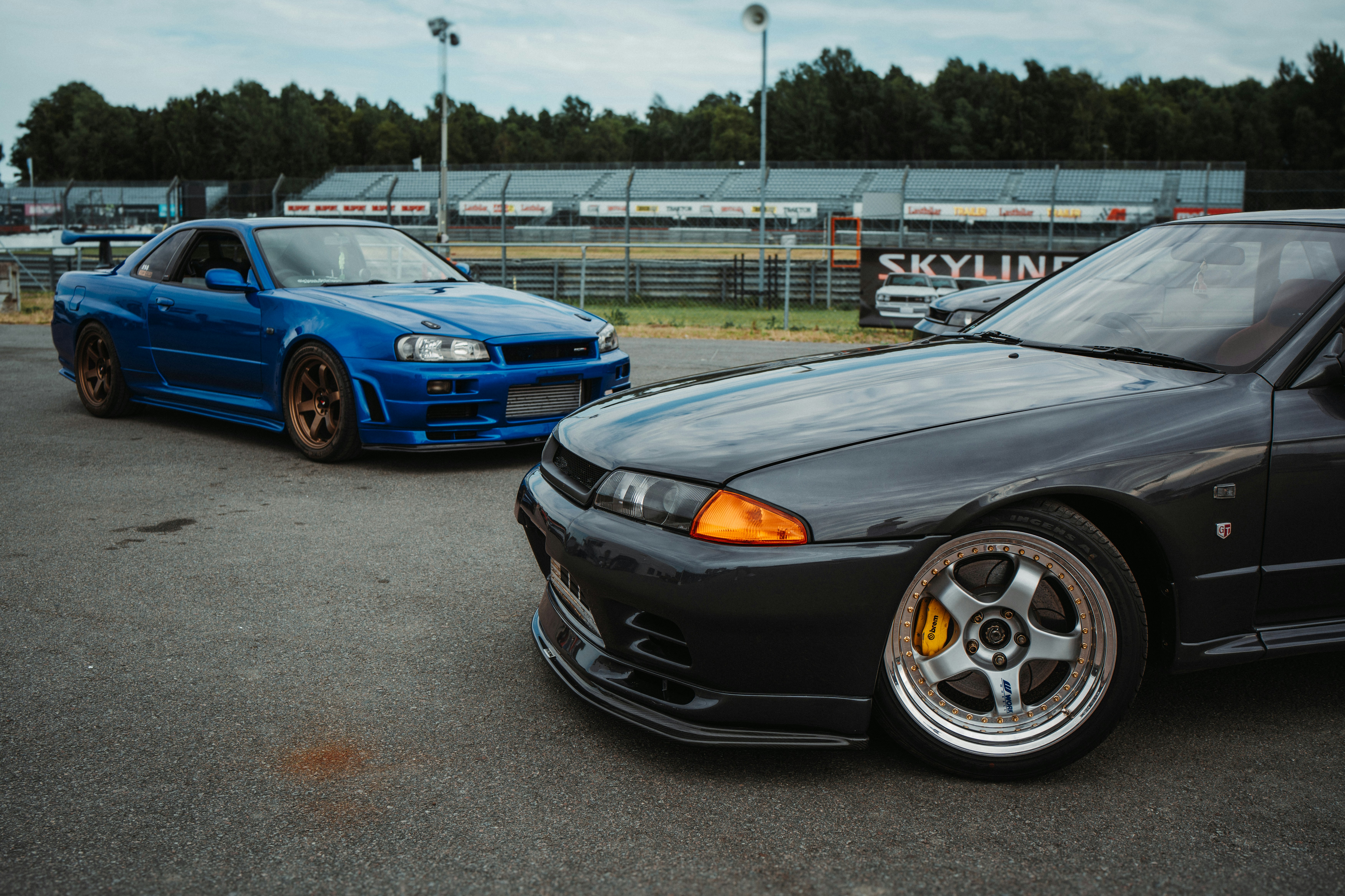Streetside Duet: Blue Precision Against Graphite Lines
