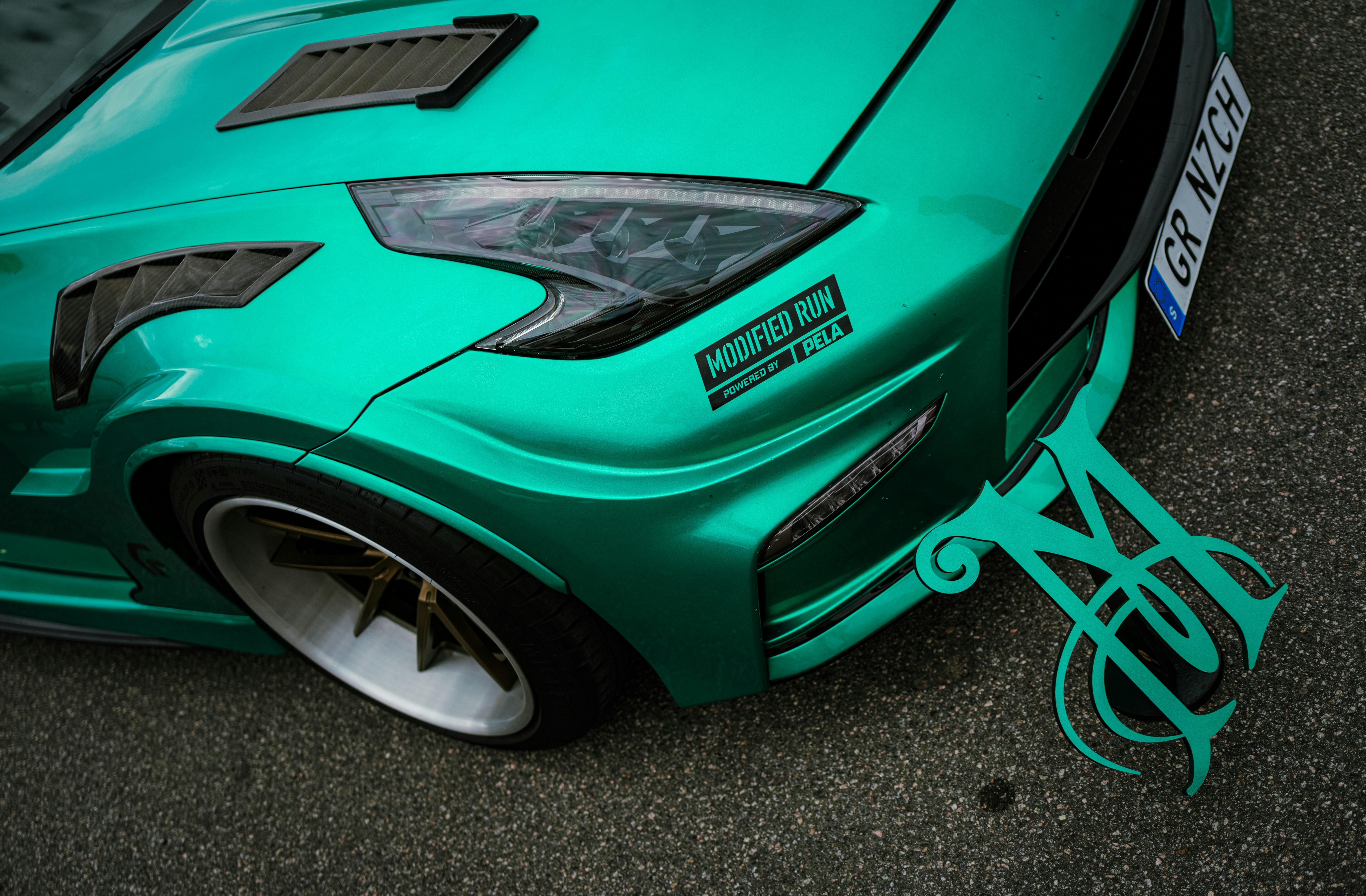 Turbo Teal: A Rushed Turn at the Track