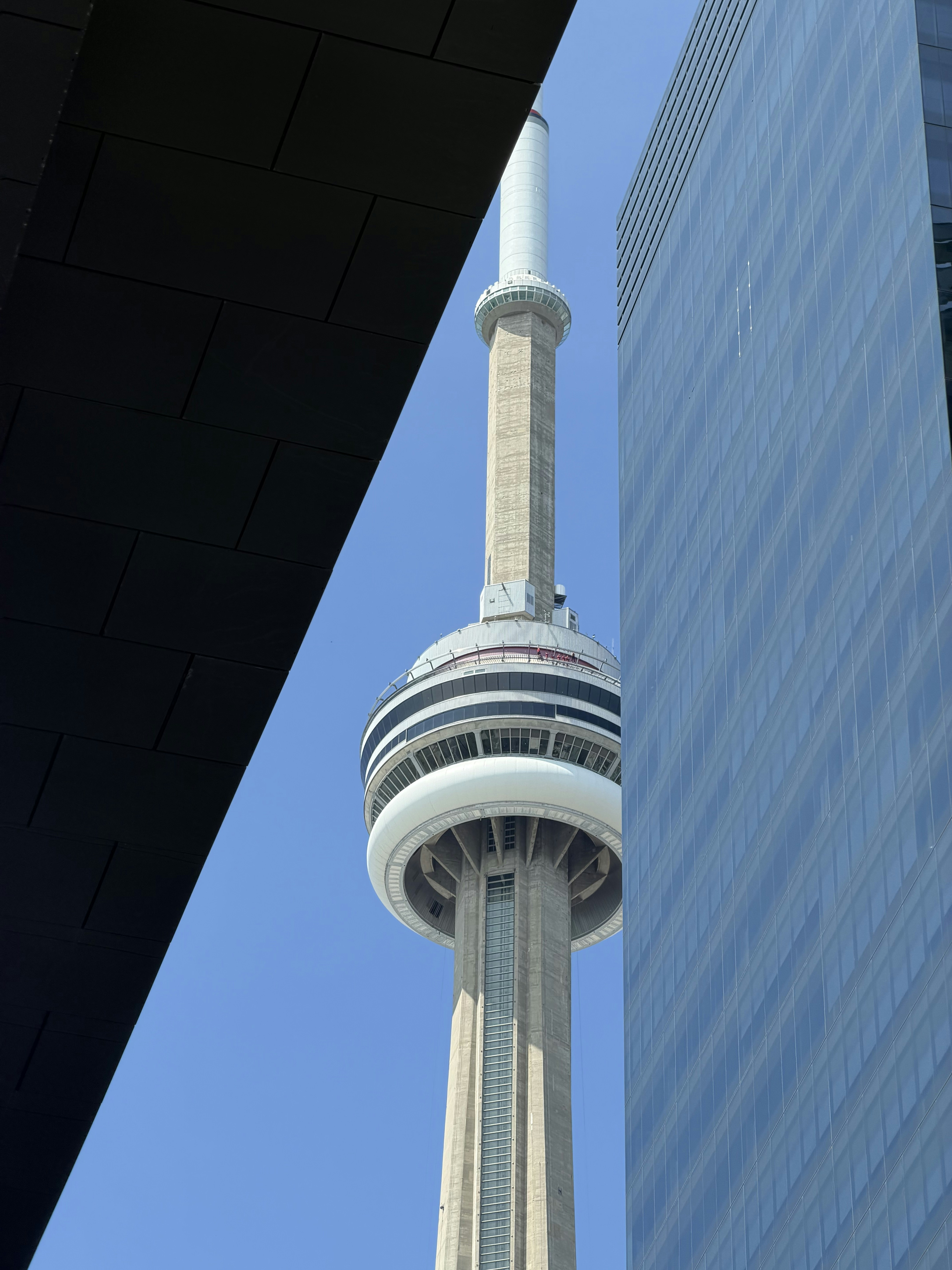 Vertical Icon: The CN Tower Pierced Between Shadows