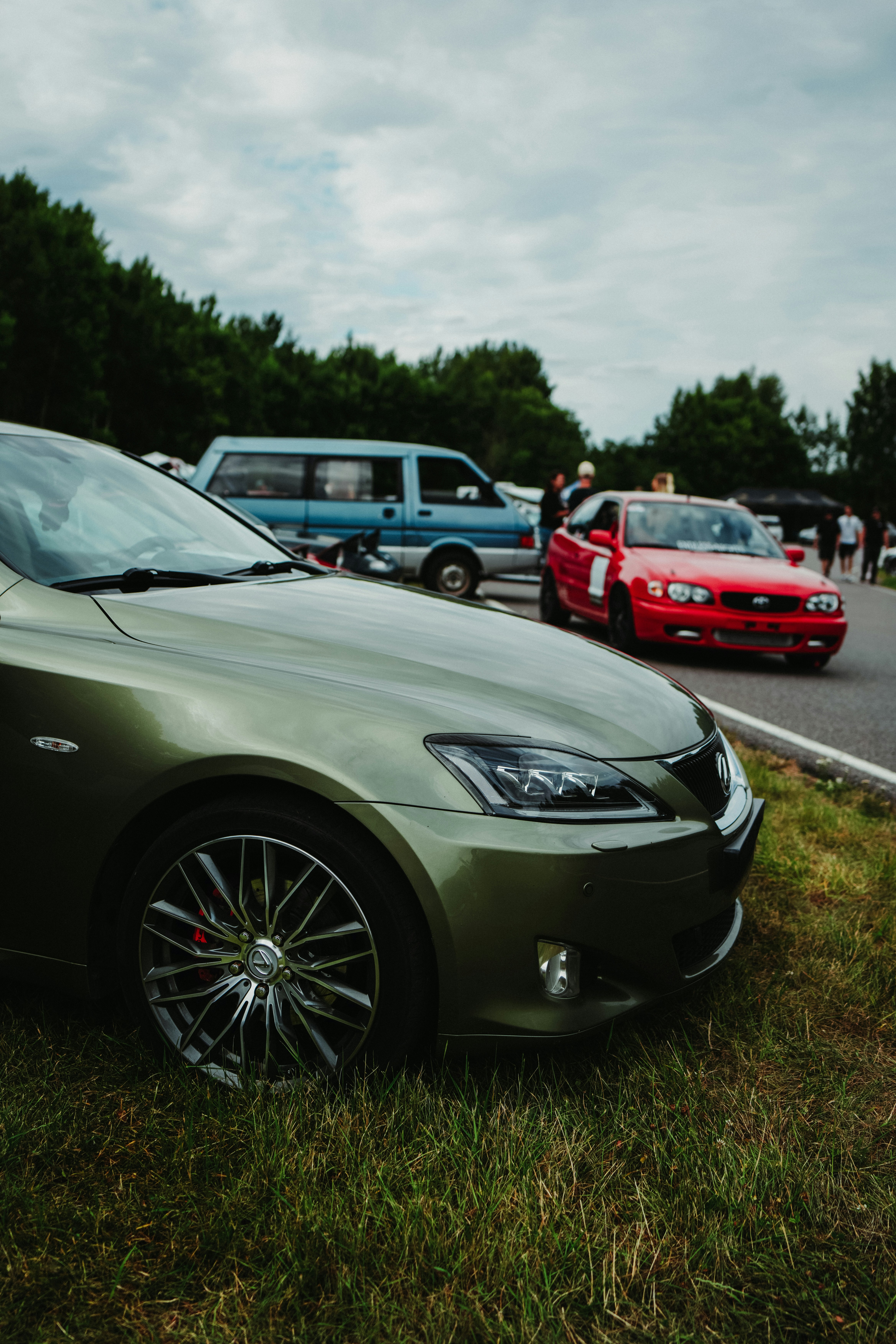 A Battery of Blazing Reds and Earthy Metal in the Park Lot