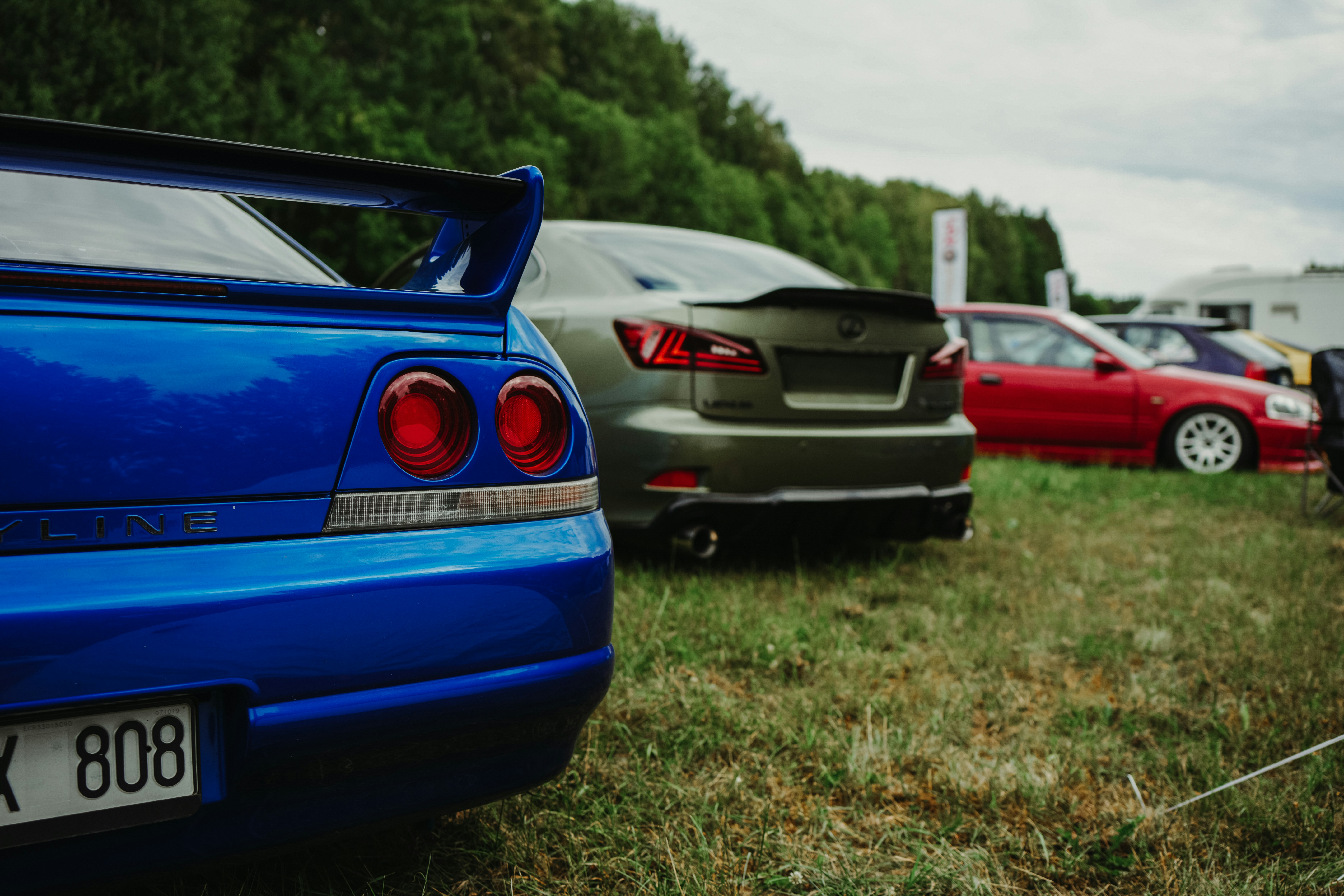 Rear-View Parade: A Blue Skyline of Modified Classics