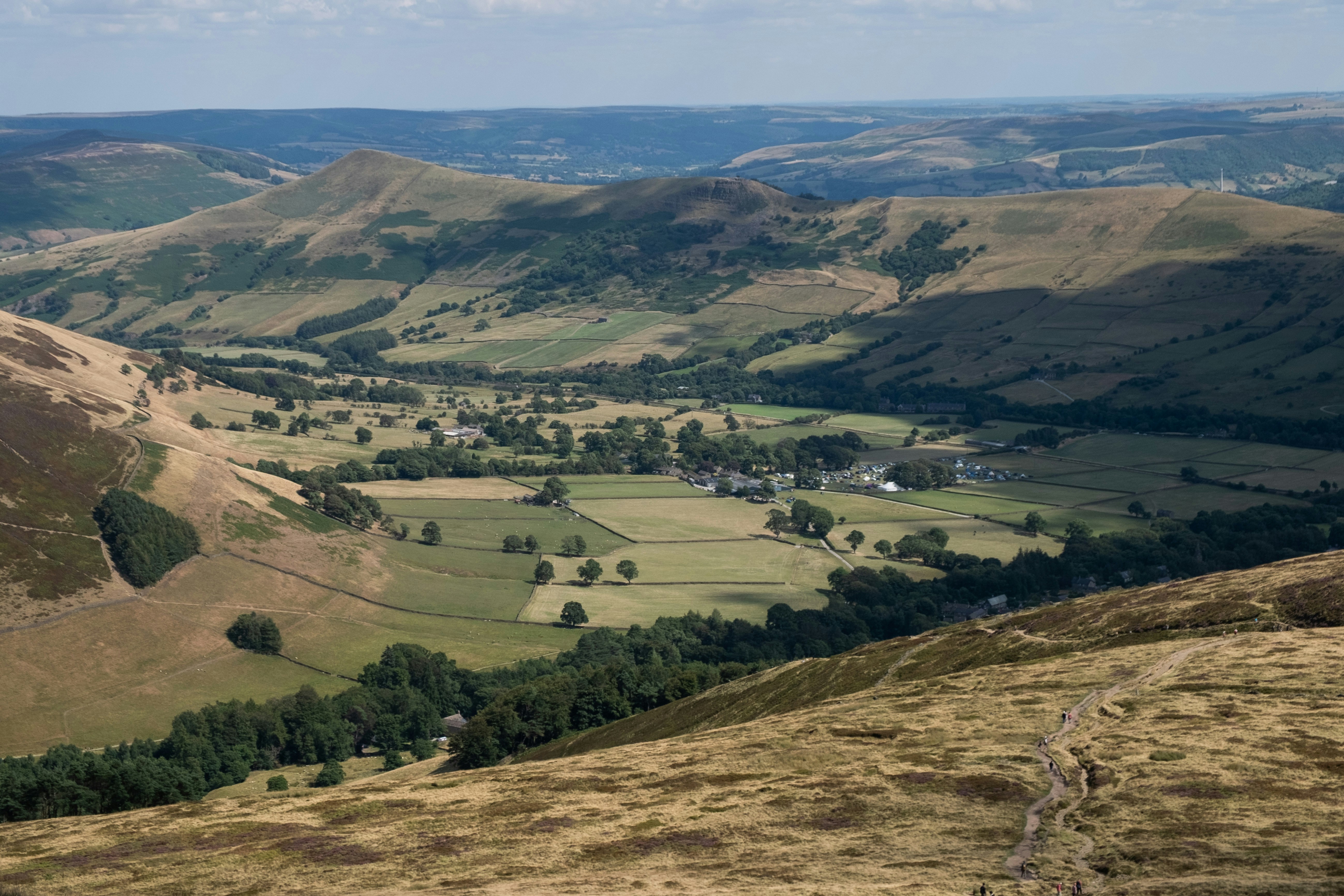 Valley Overlook: Patchwork Fields Under Rolling Hills