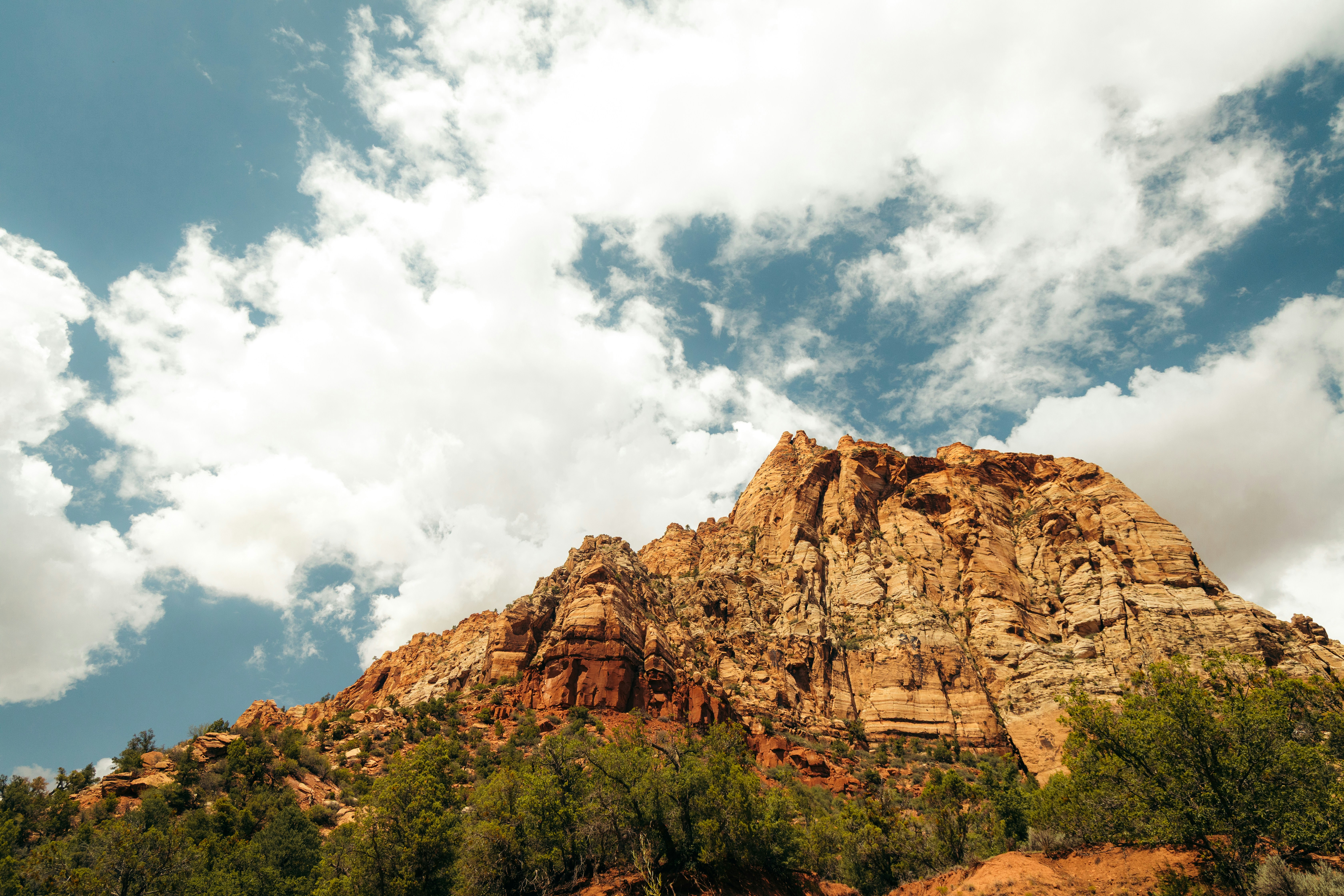 Crimson Fortress: Sunlit Canyon Cliffs Against a Velvet Sky