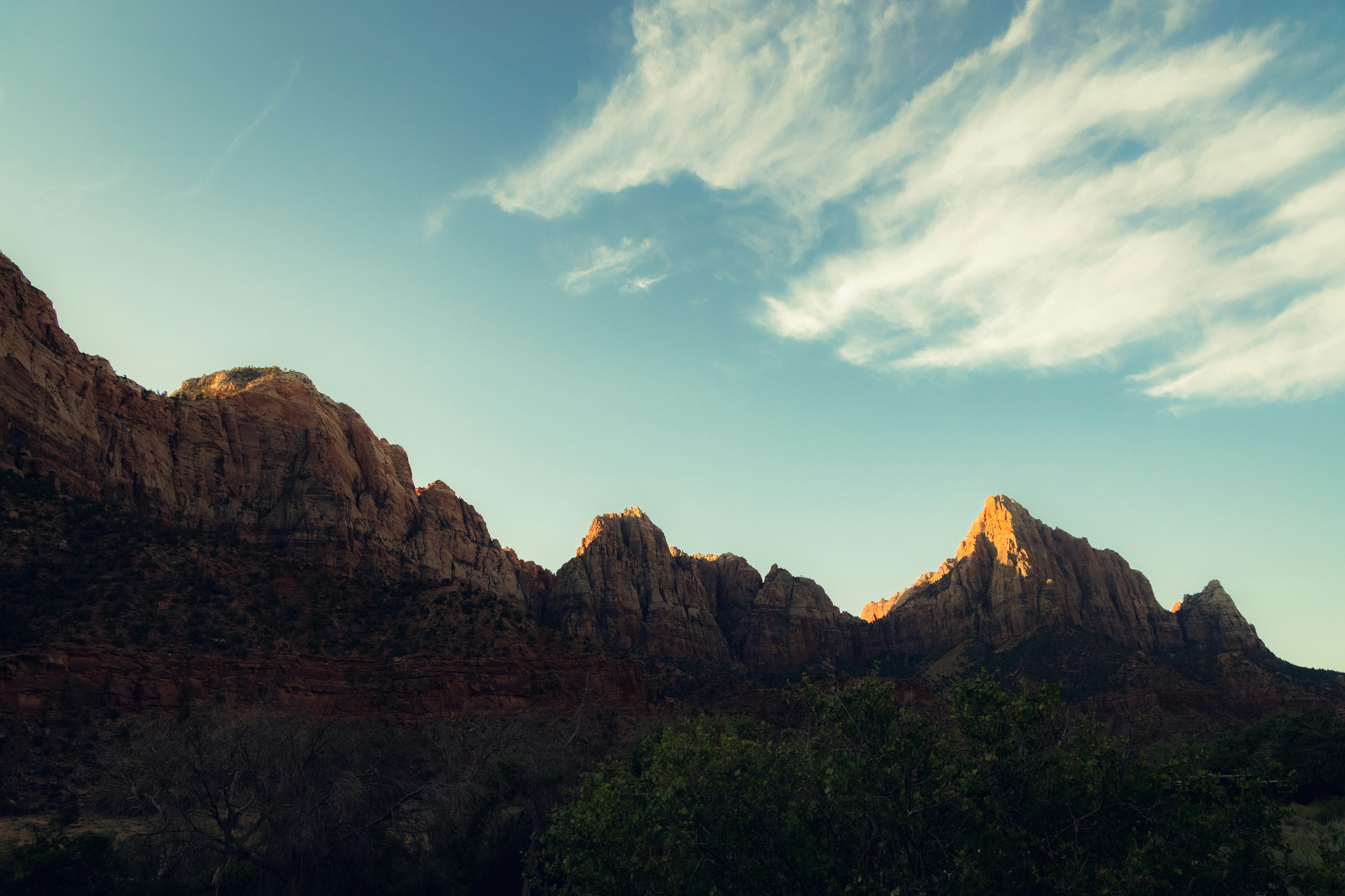 Sunlit Ridge: The Golden Peak in a Desert Skyline