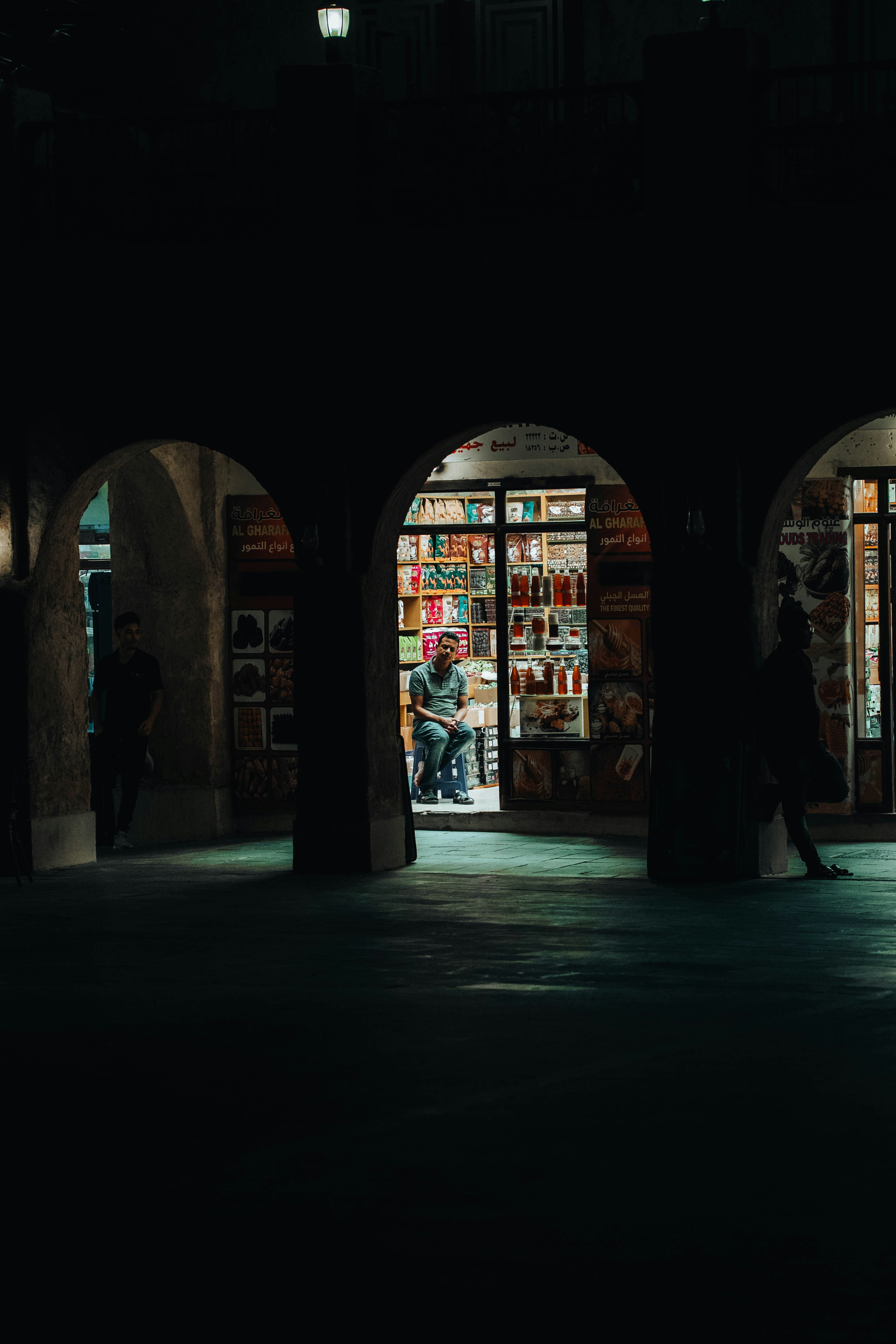 Midnight Shopfront: A Quiet Moment Through the Archways