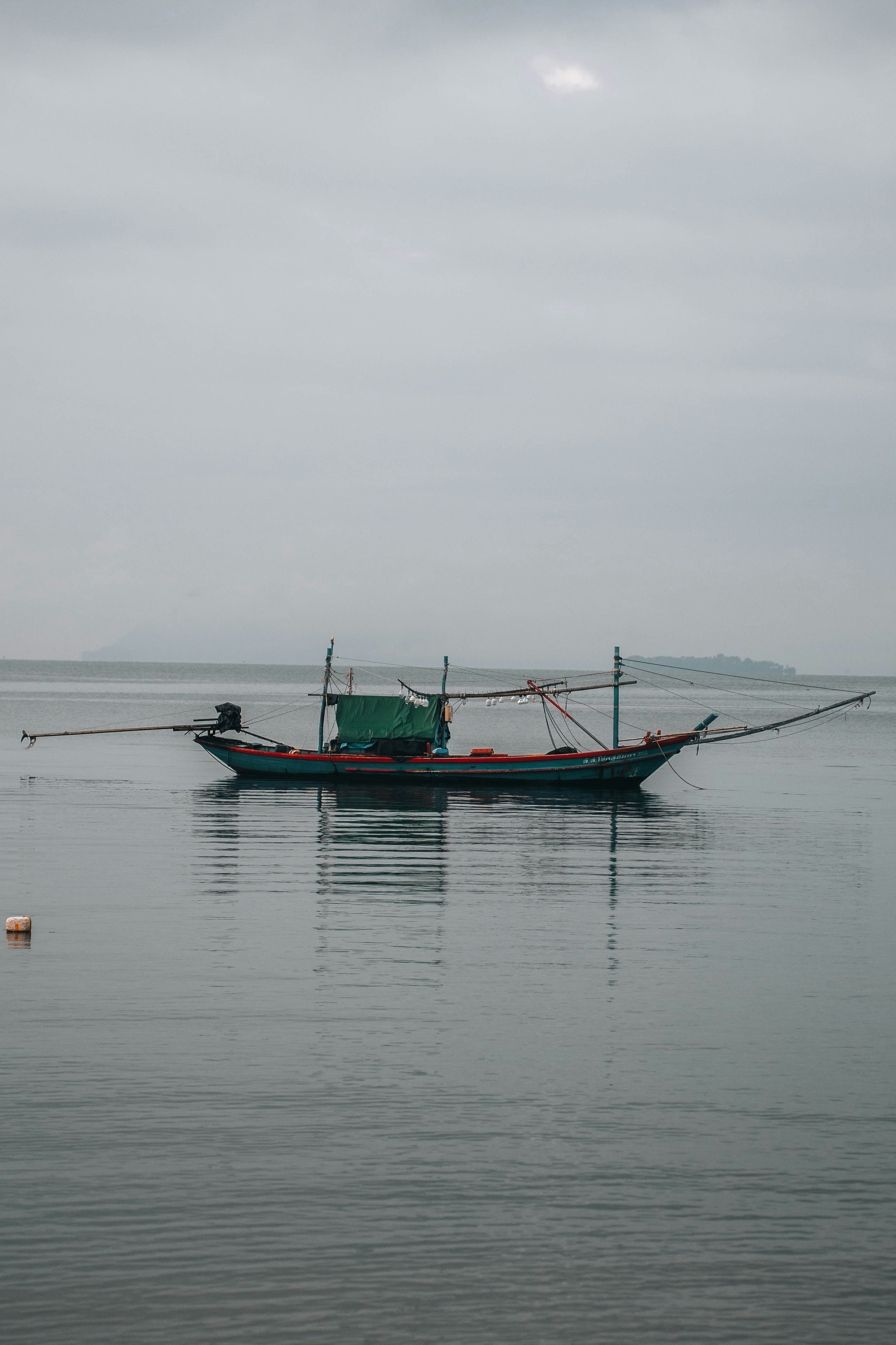 Calm Vessel on a Misty Horizon