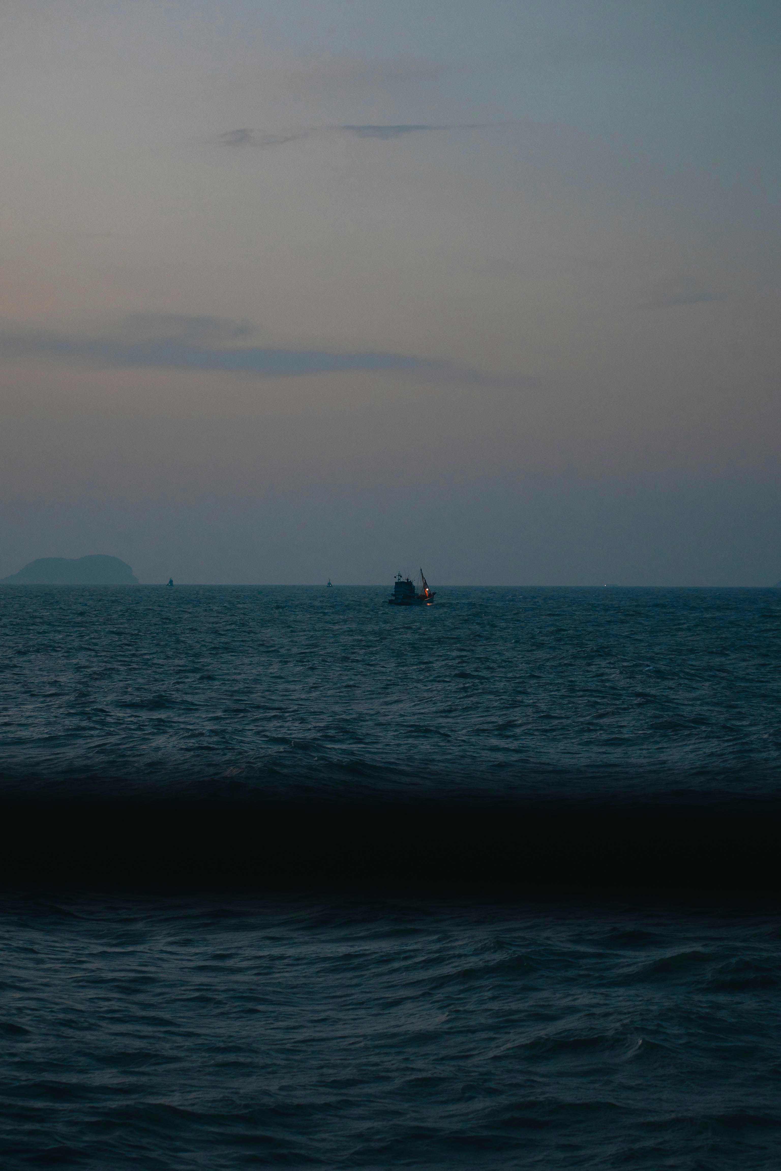 Far Horizon Vessel: A Quiet Seascape Beneath Dusk