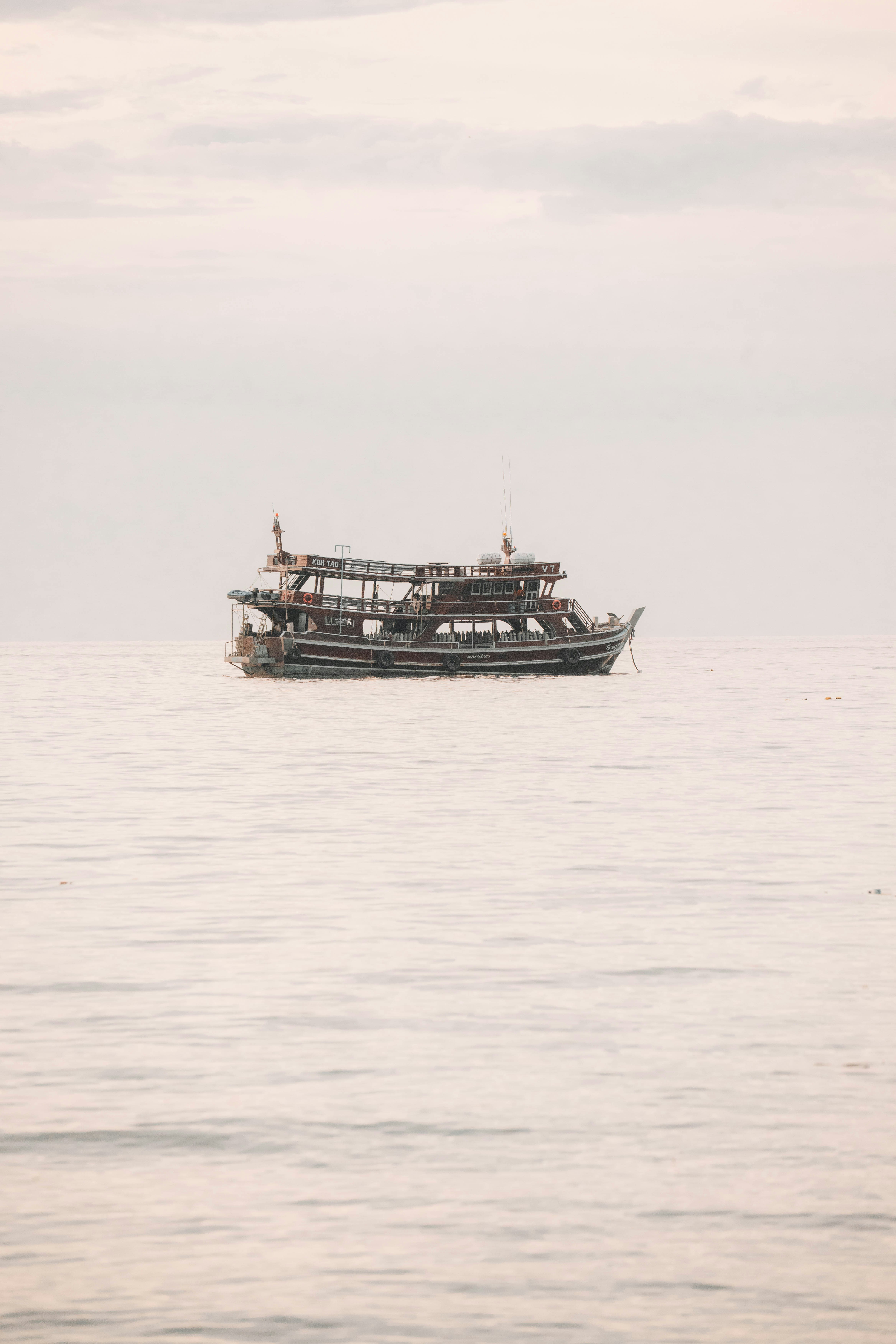 A Maritime Echo: The Passenger Boat on a Quiet Sunrise Sea