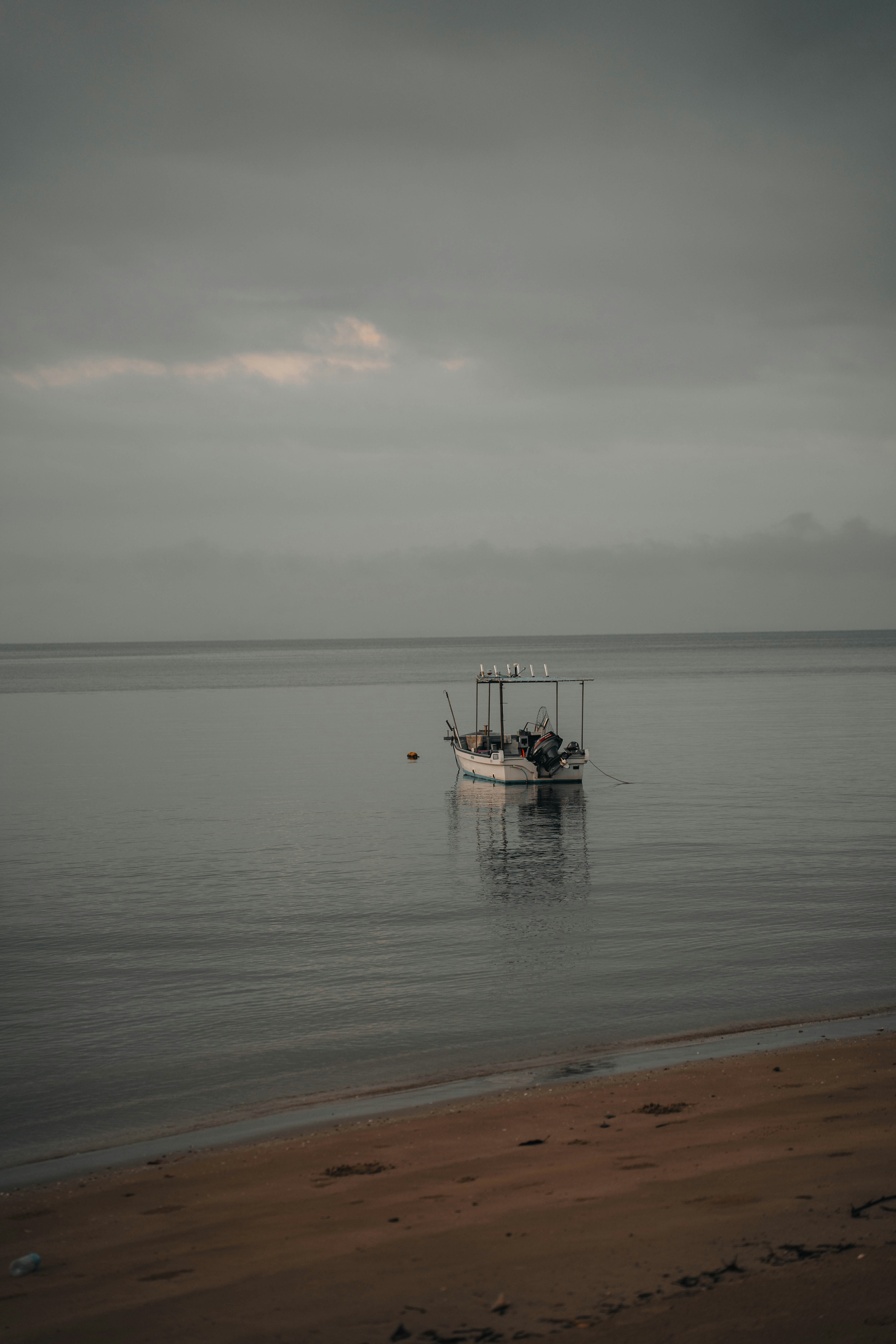 Boat Anchored on a Quiet Glimmer: Dusk at the Quiet Bay