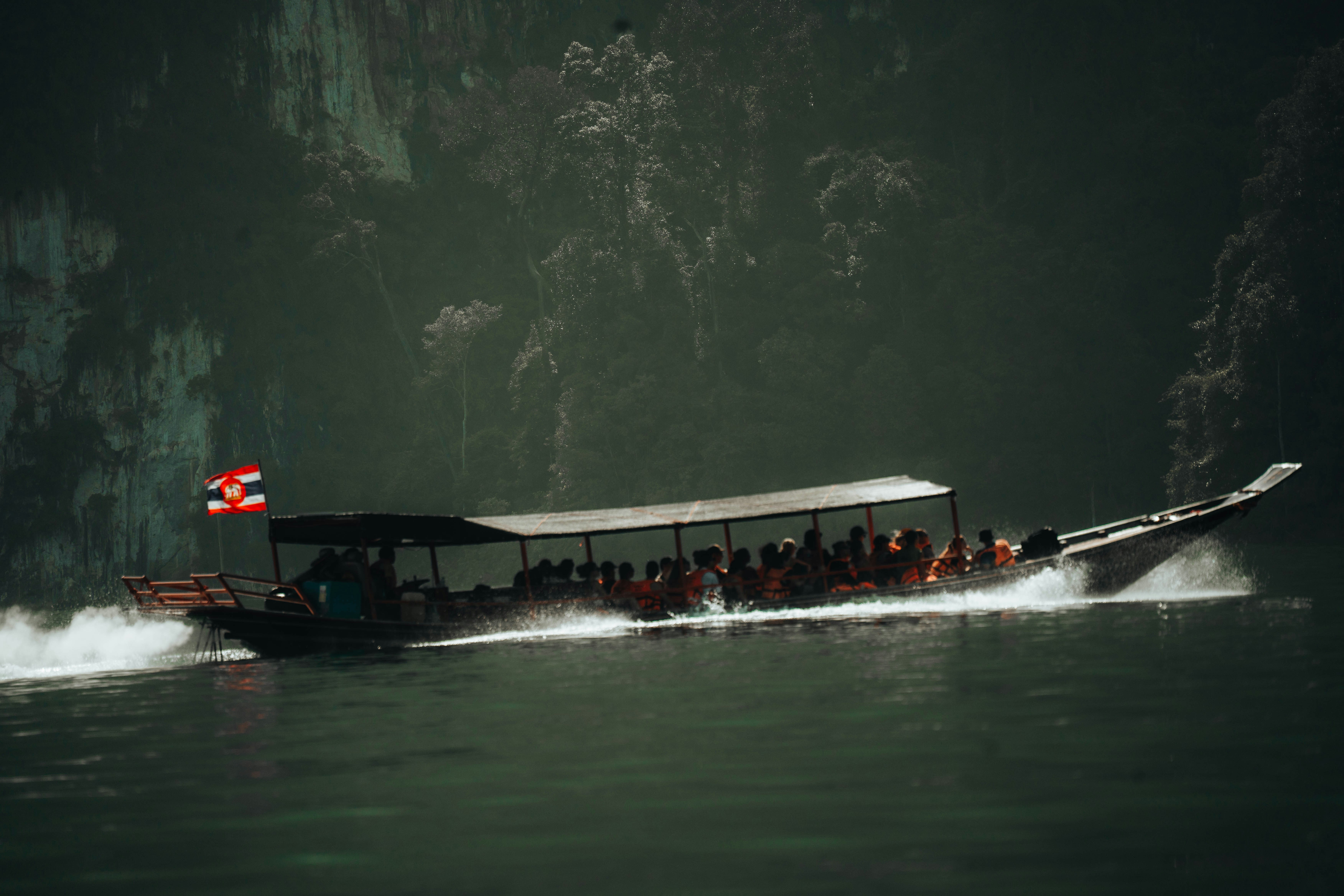 The Long Craft Slicing Through Emerald Waters