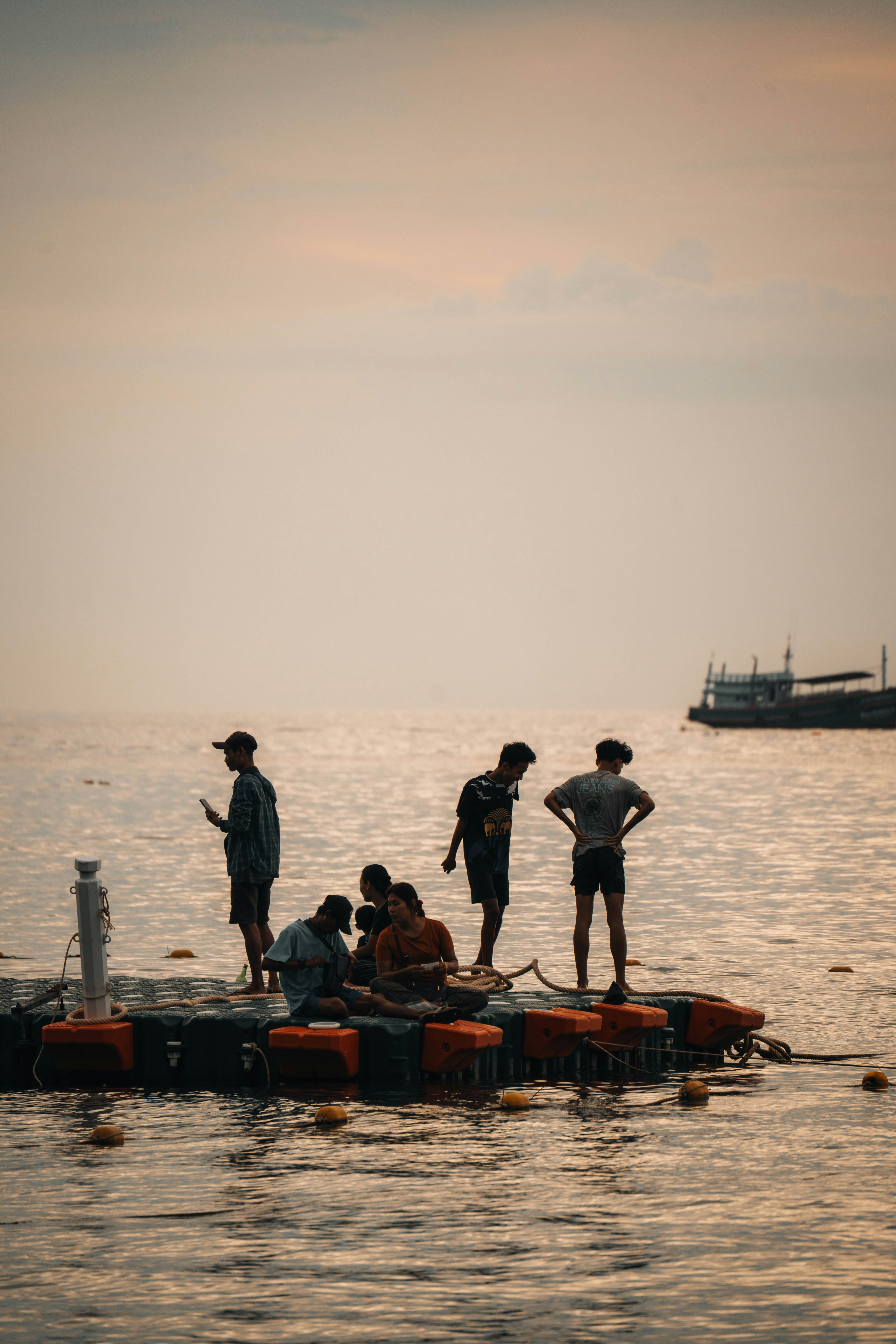 Sunset on the Pier: A Small Group Ashore on Floating platform
