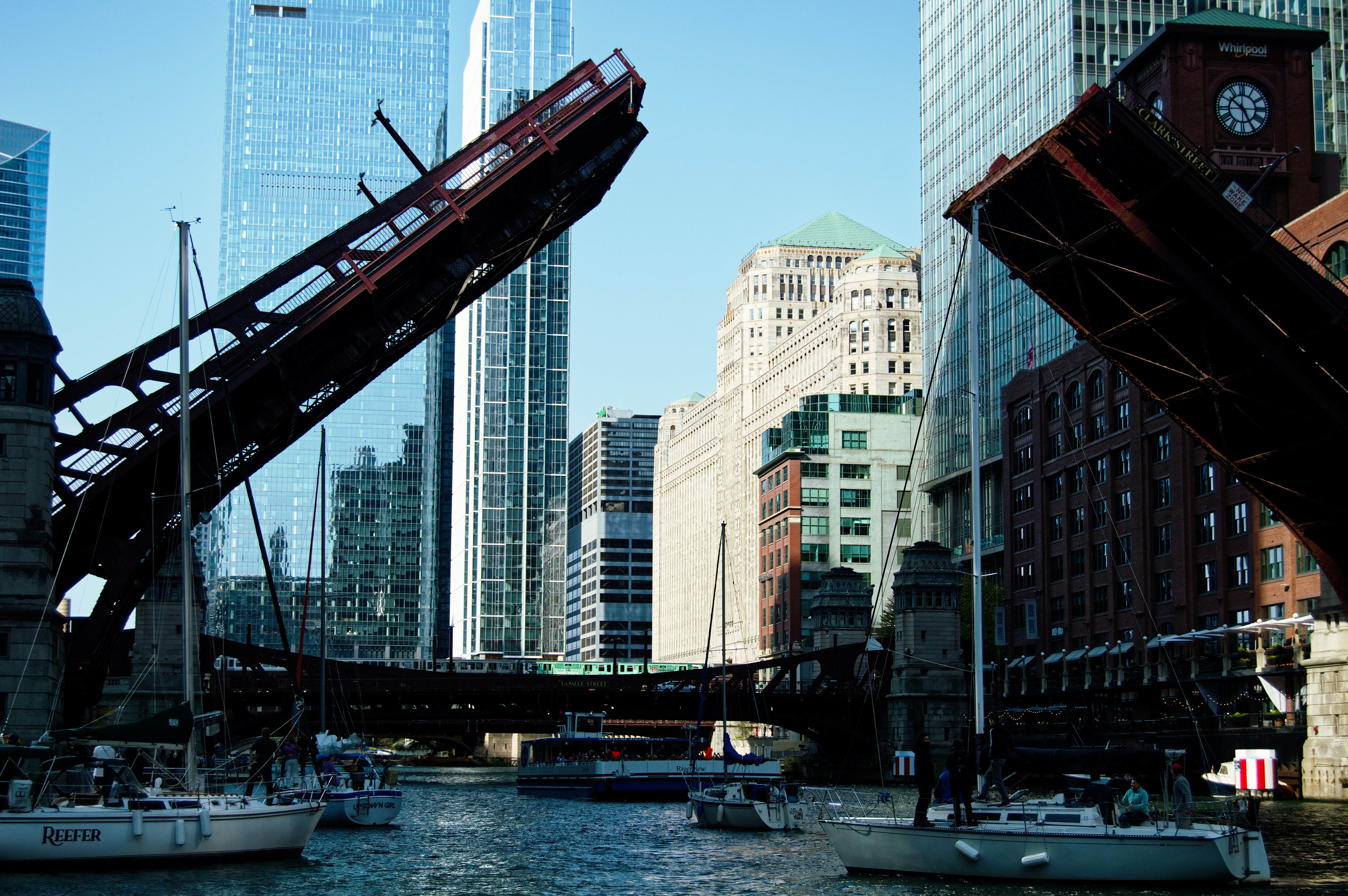 Rising Cityscape: The Lifted Gateway Over a Calm Marina