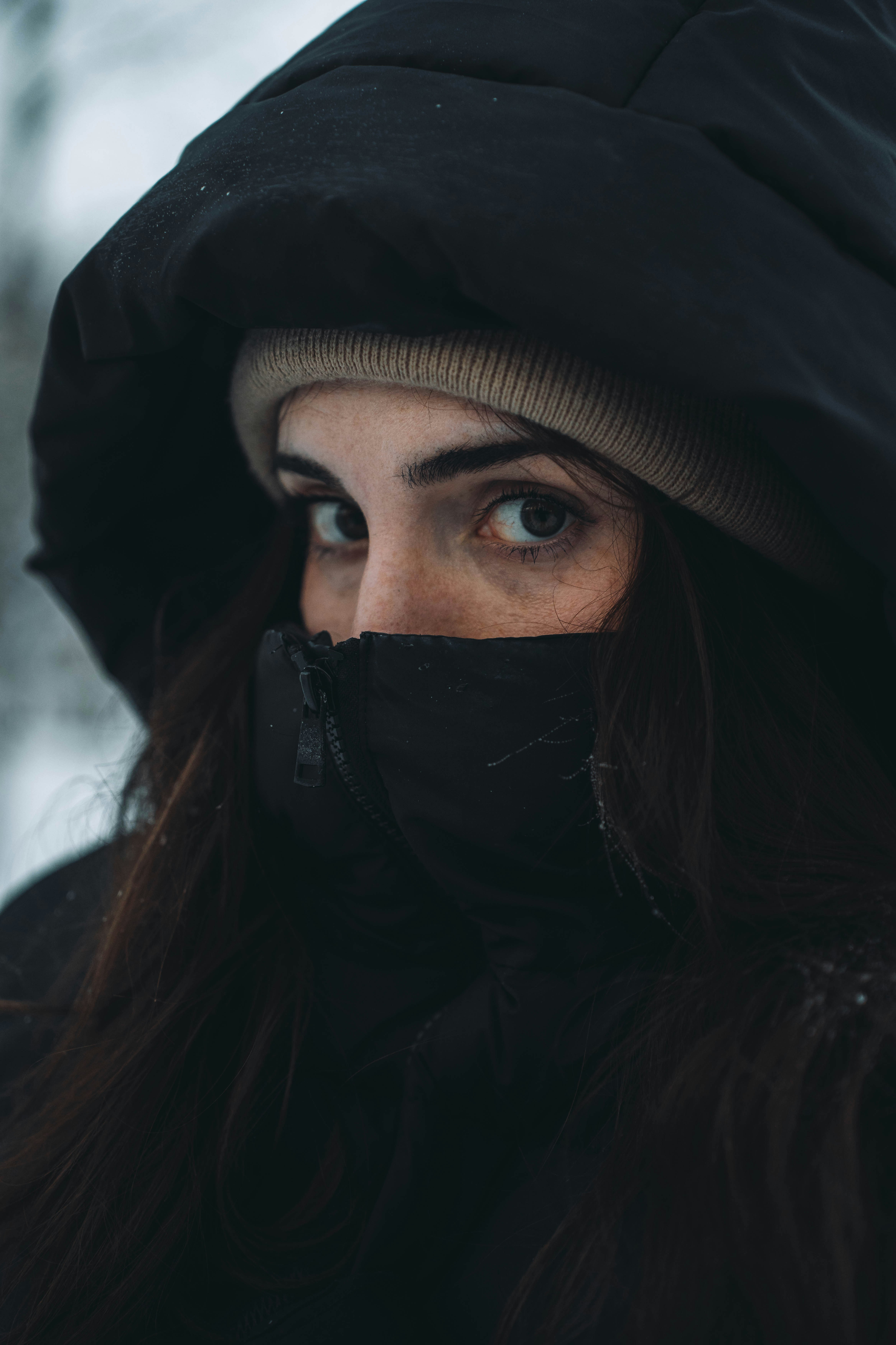 Winter Veil: Focused Gaze in a Snowbound Hood