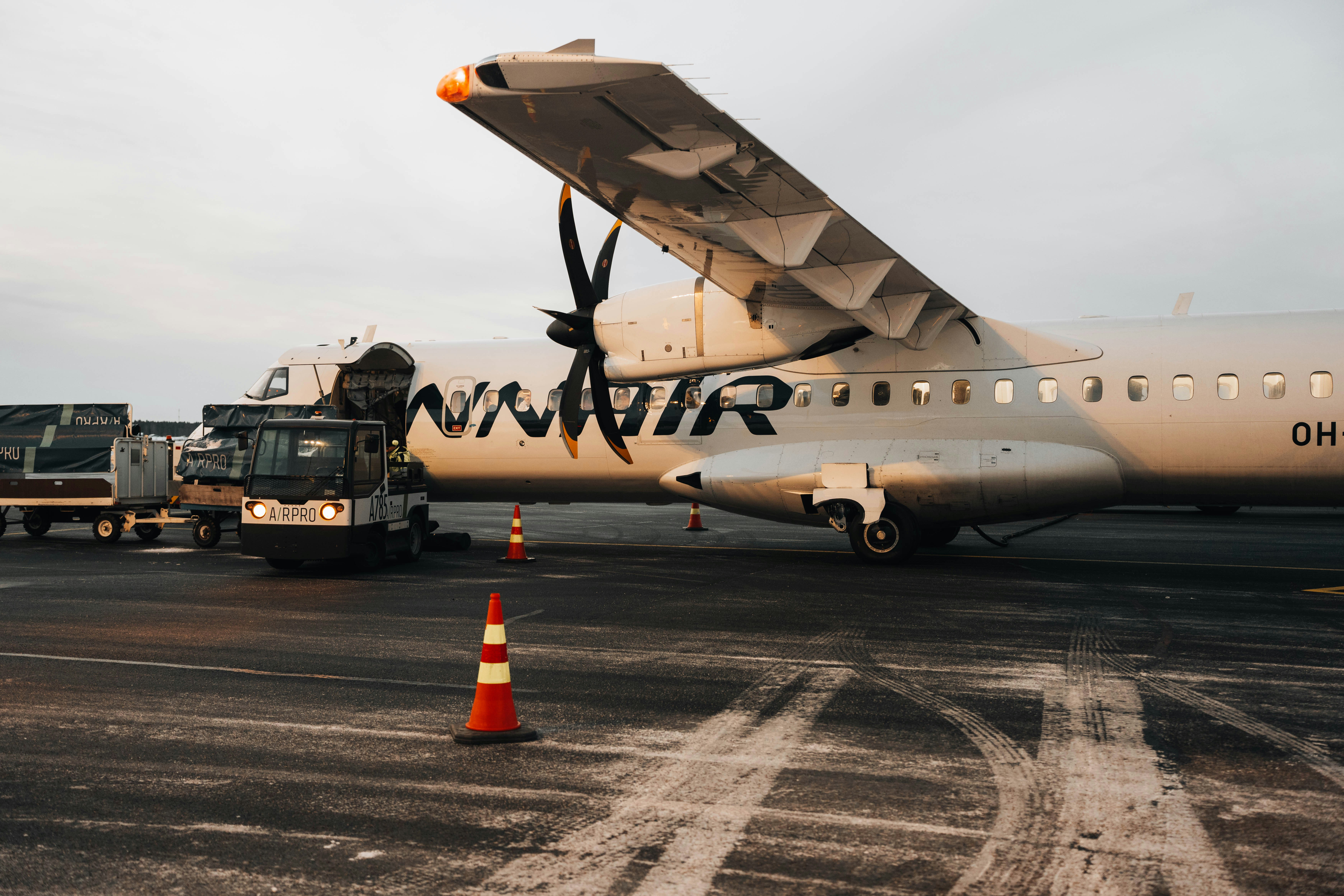 Propeller Power at Dawn: A Virgin Aircraft Idle at Ground Crew Horizon