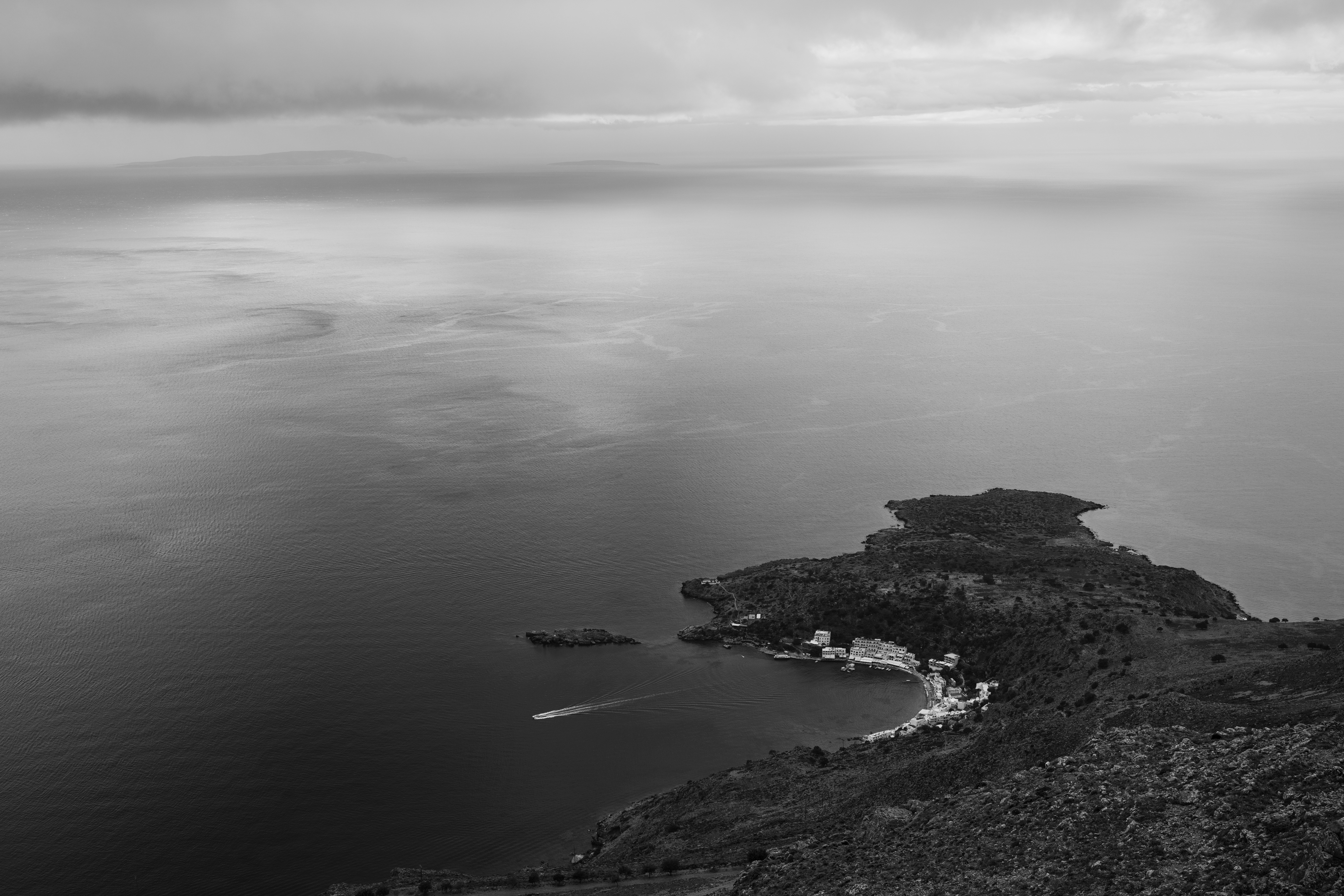 Edge of the Caldera: A Quiet Coastal Cluster from Above