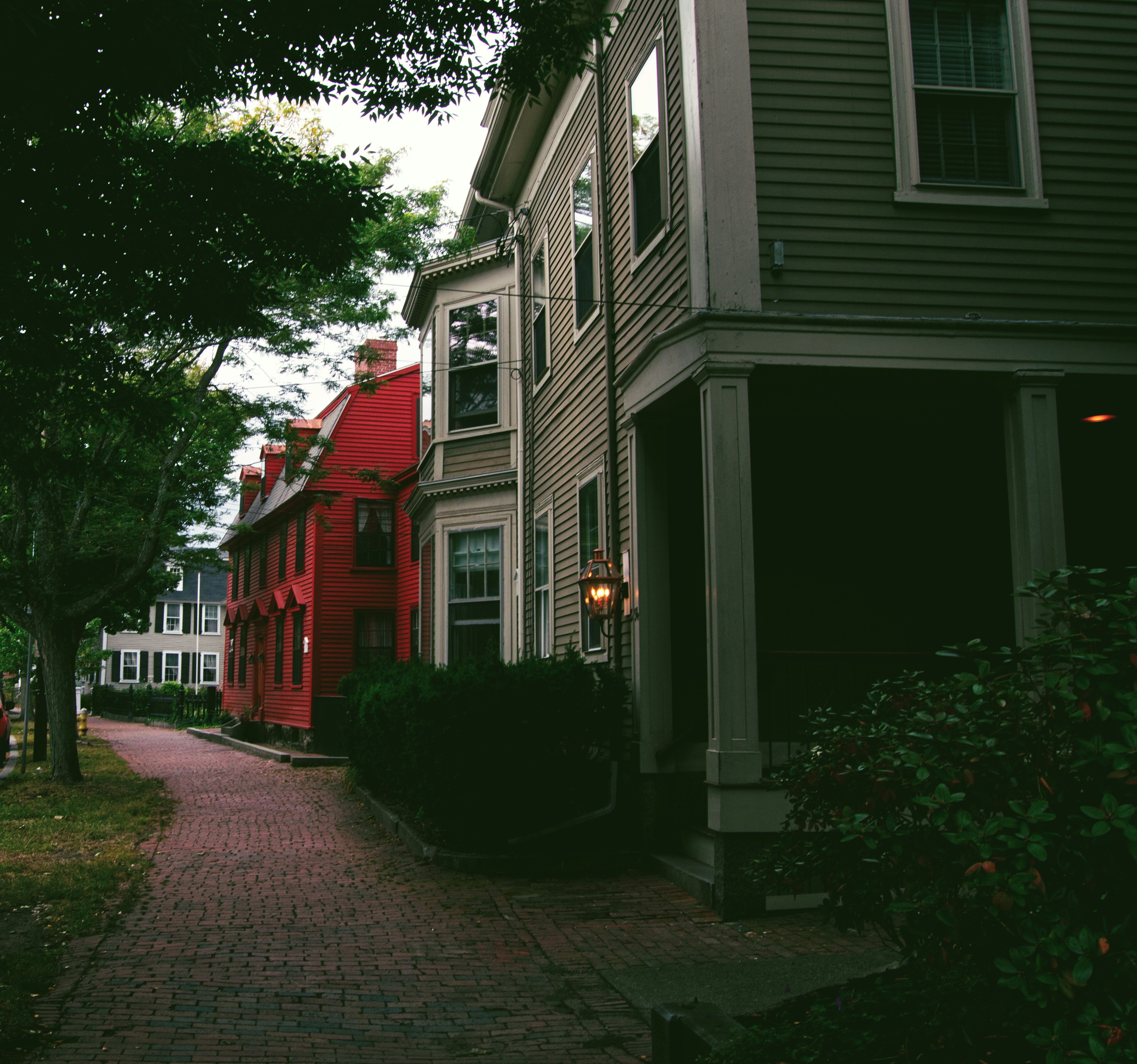 Cobbled Pathway Through a Quiet Row of Painted Homes