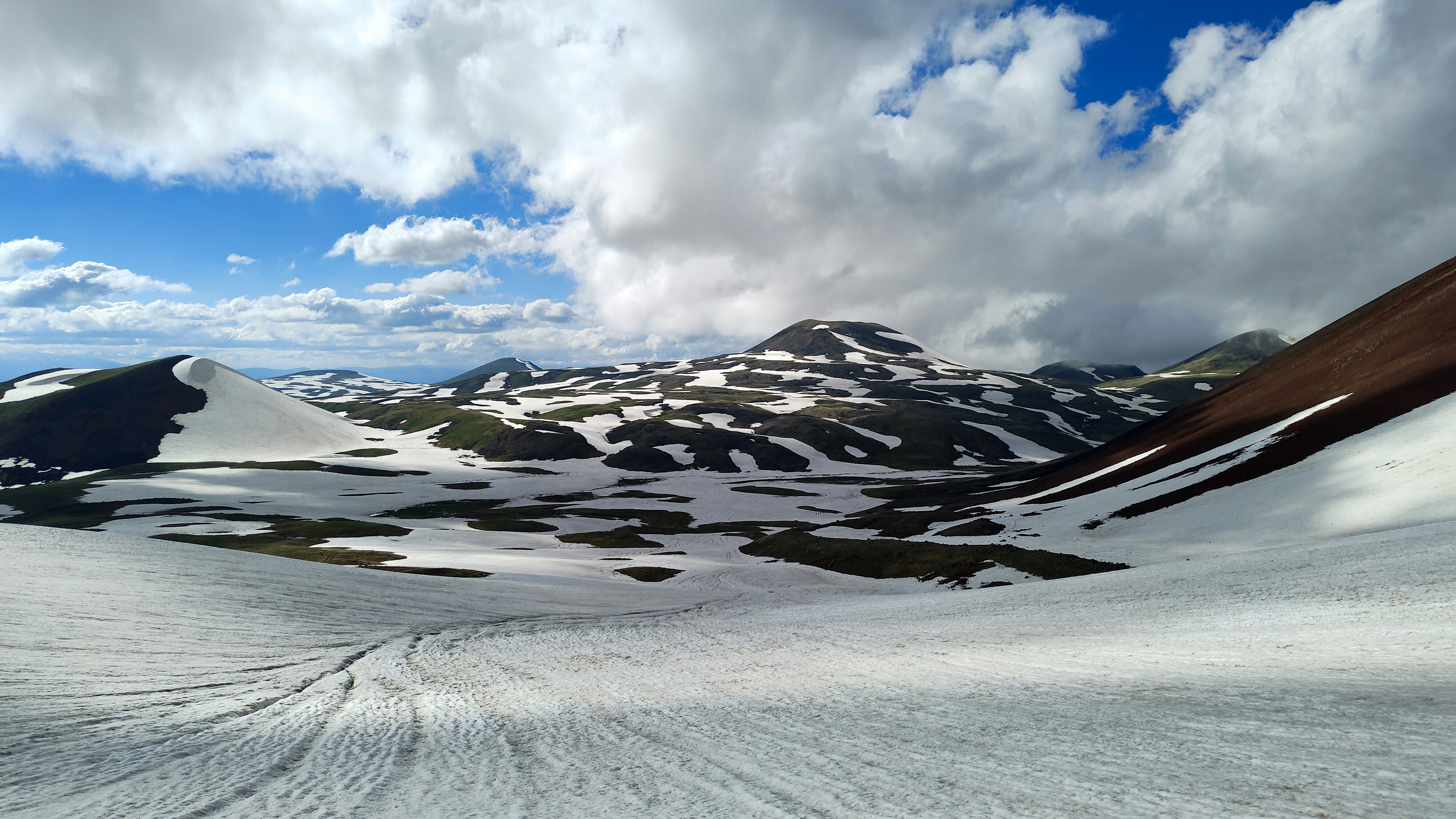 Blue Sky Over Monochrome Peaks: A Glacial Tapestry