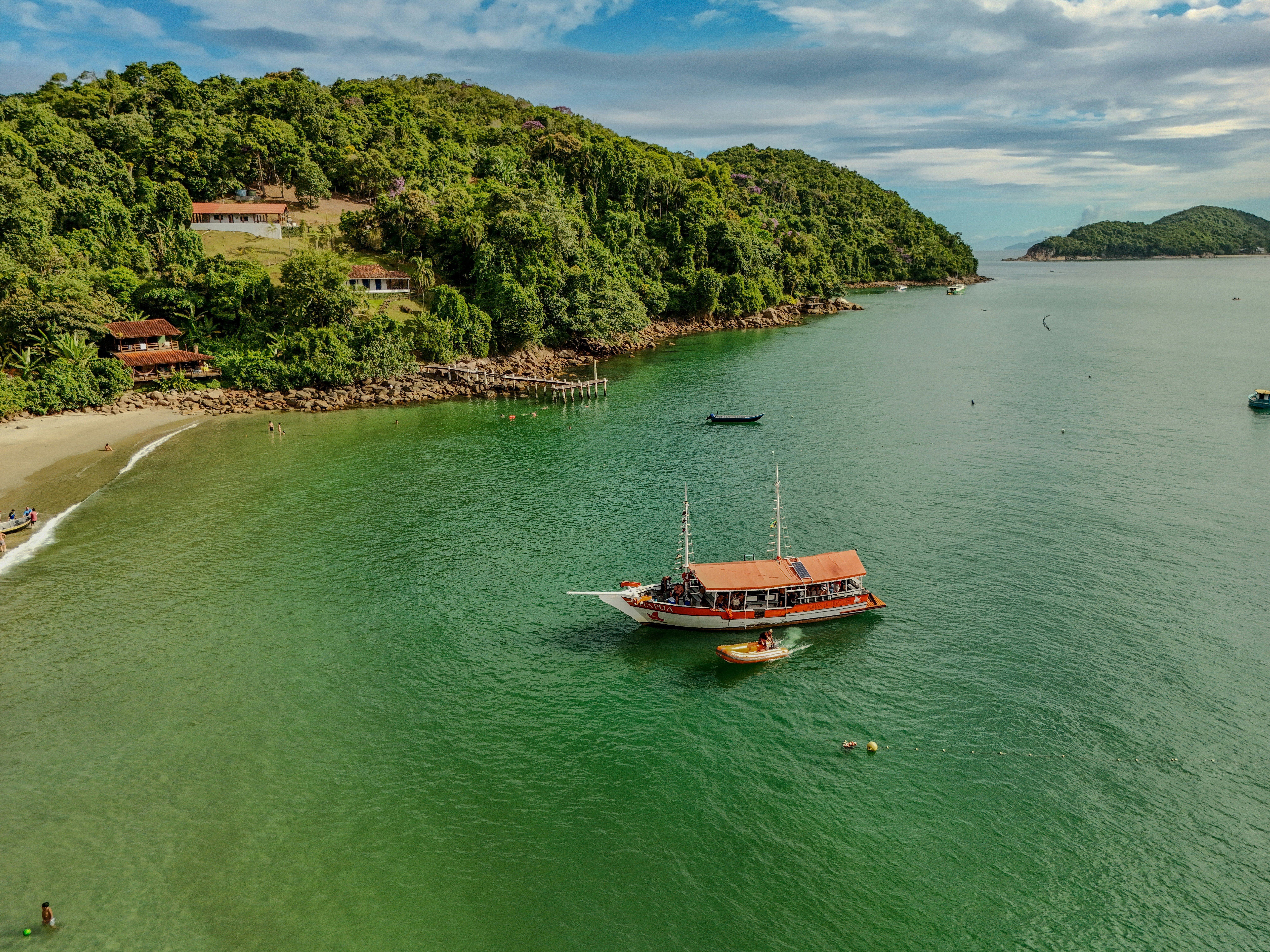 Azure Vessel Drifting Along a Quiet Cove