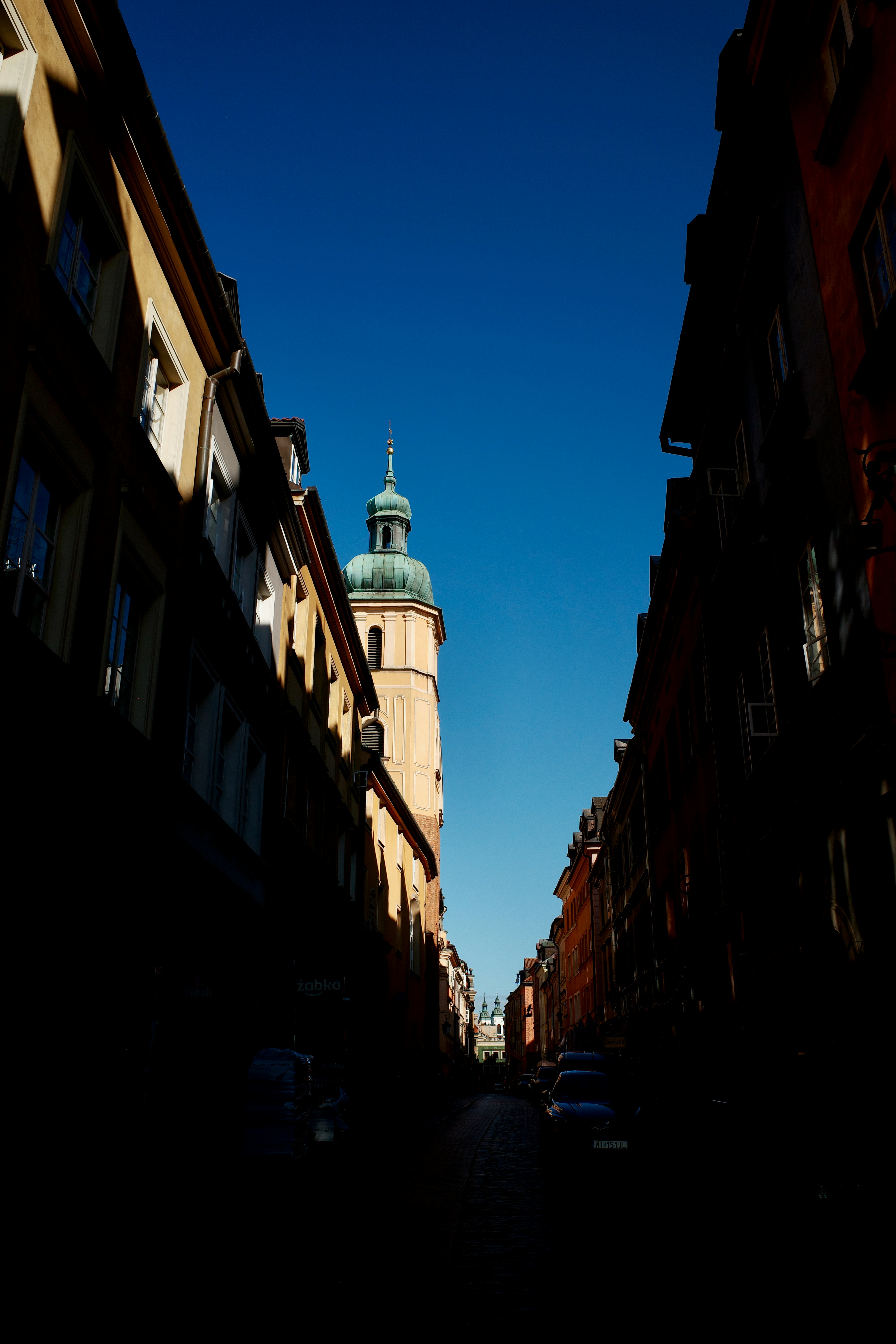 Tower in the Blue: Narrow Street with a City Hall Dome