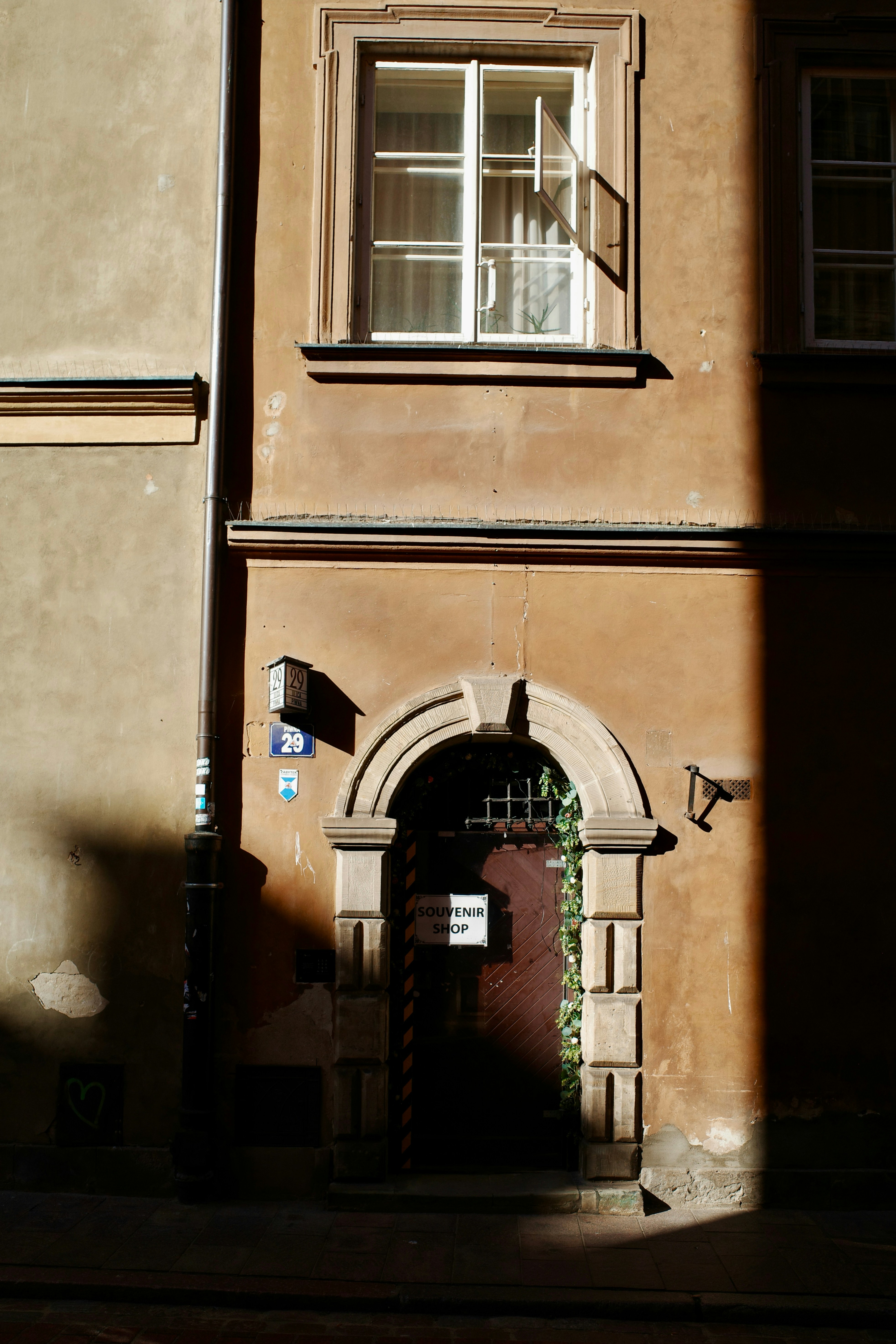 Shadowed Archway: Dim Light at a Timeless Entrance