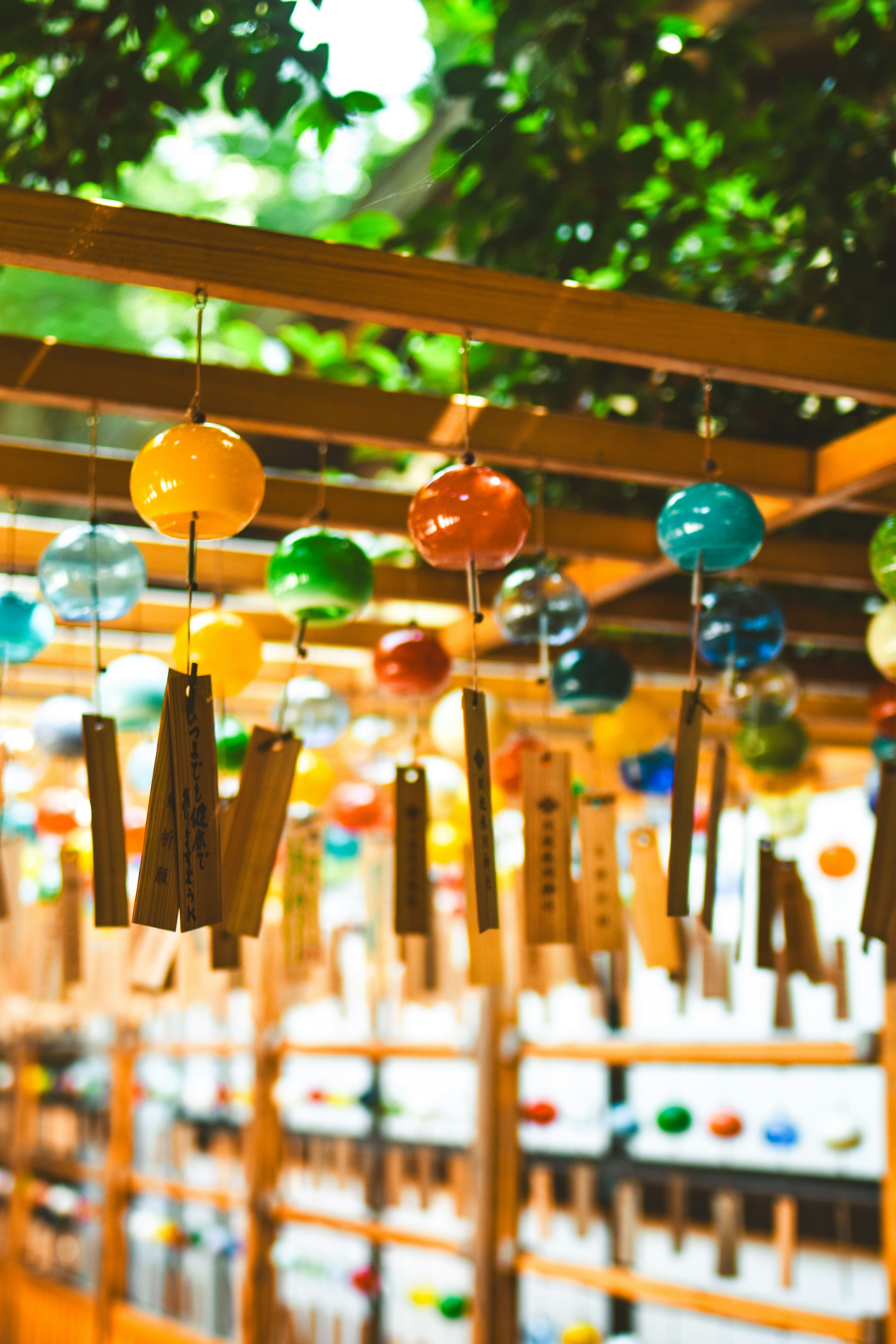 Wind-Chimed Orbs: A Corridor of Colorful Ornaments