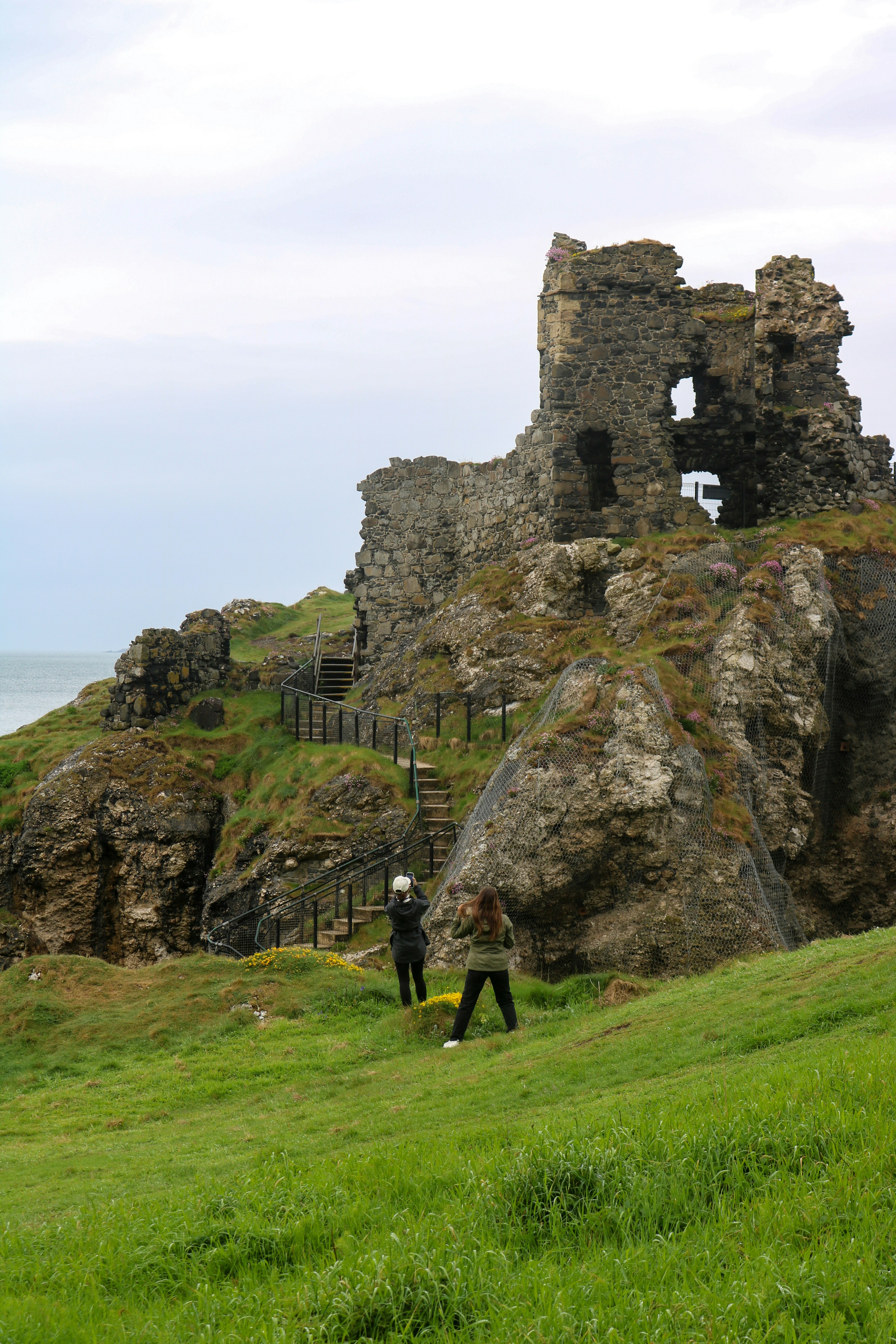 Ruined Clifftop Fortress Under Overcast Skies