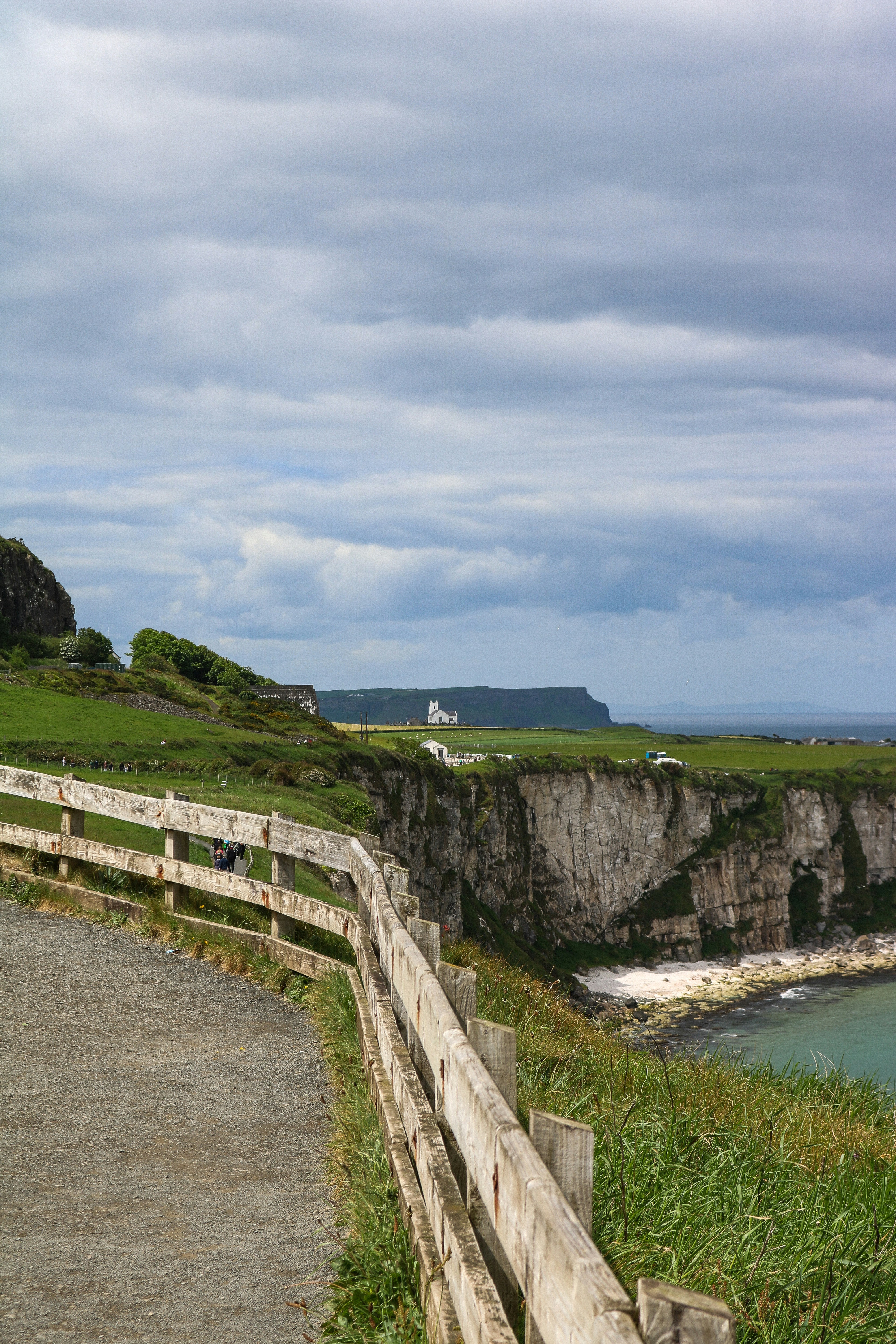 Clifftop Path Winds Along the Emerald Sea