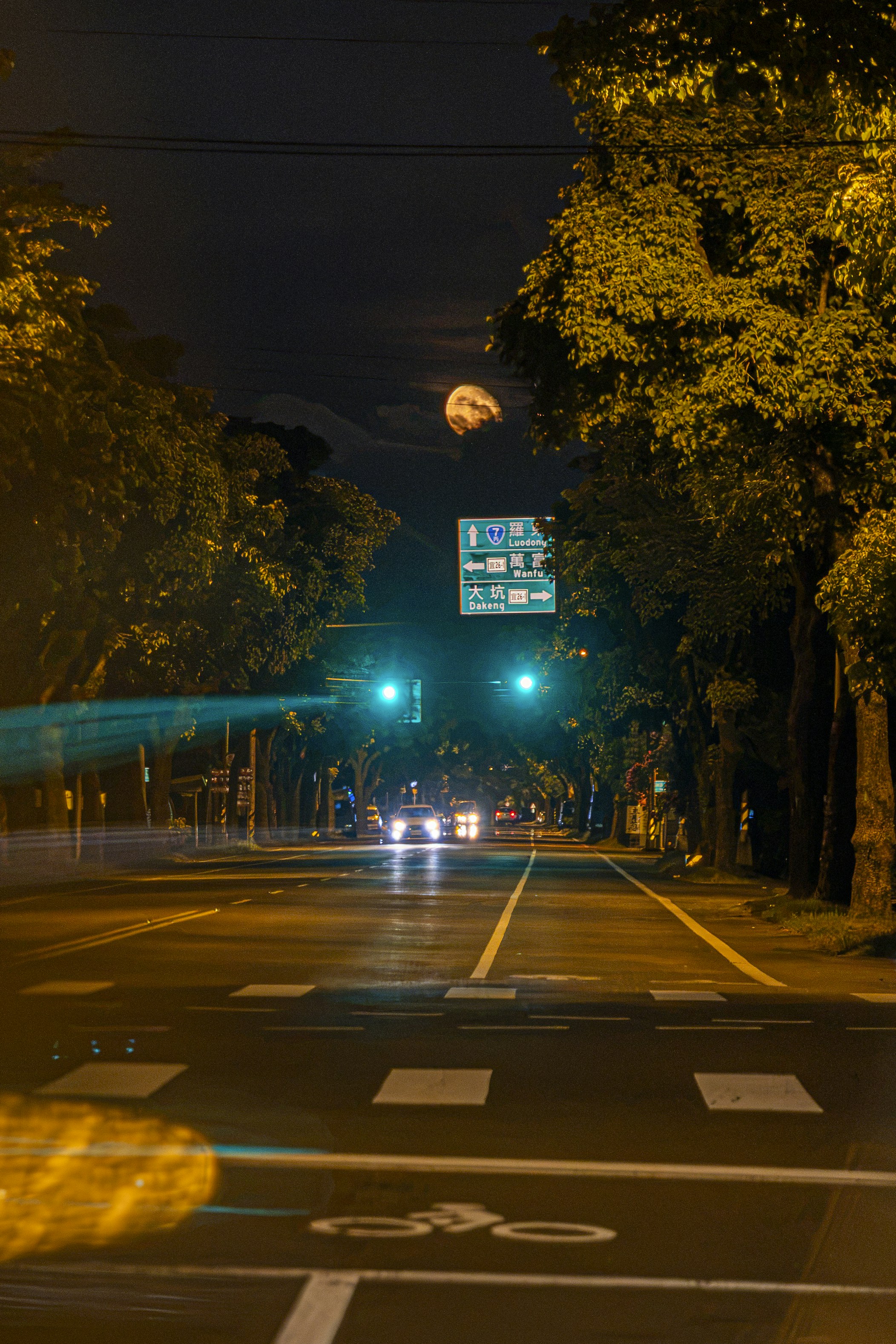 Moonlit Street: A Quiet Urban Night with a Luminous Moon