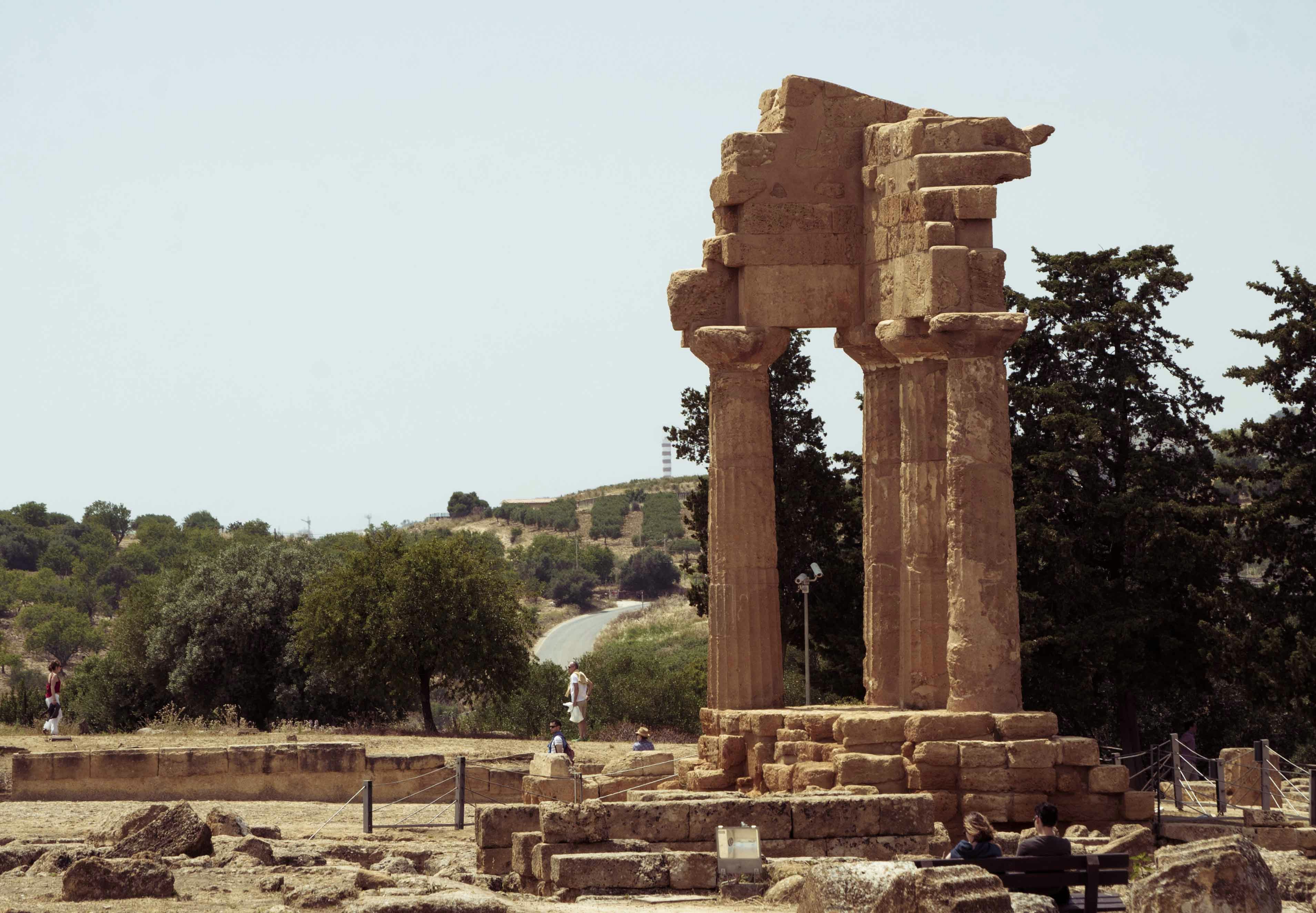 Stone Gatekeeper: Ruins Framing a Sunlit Horizon