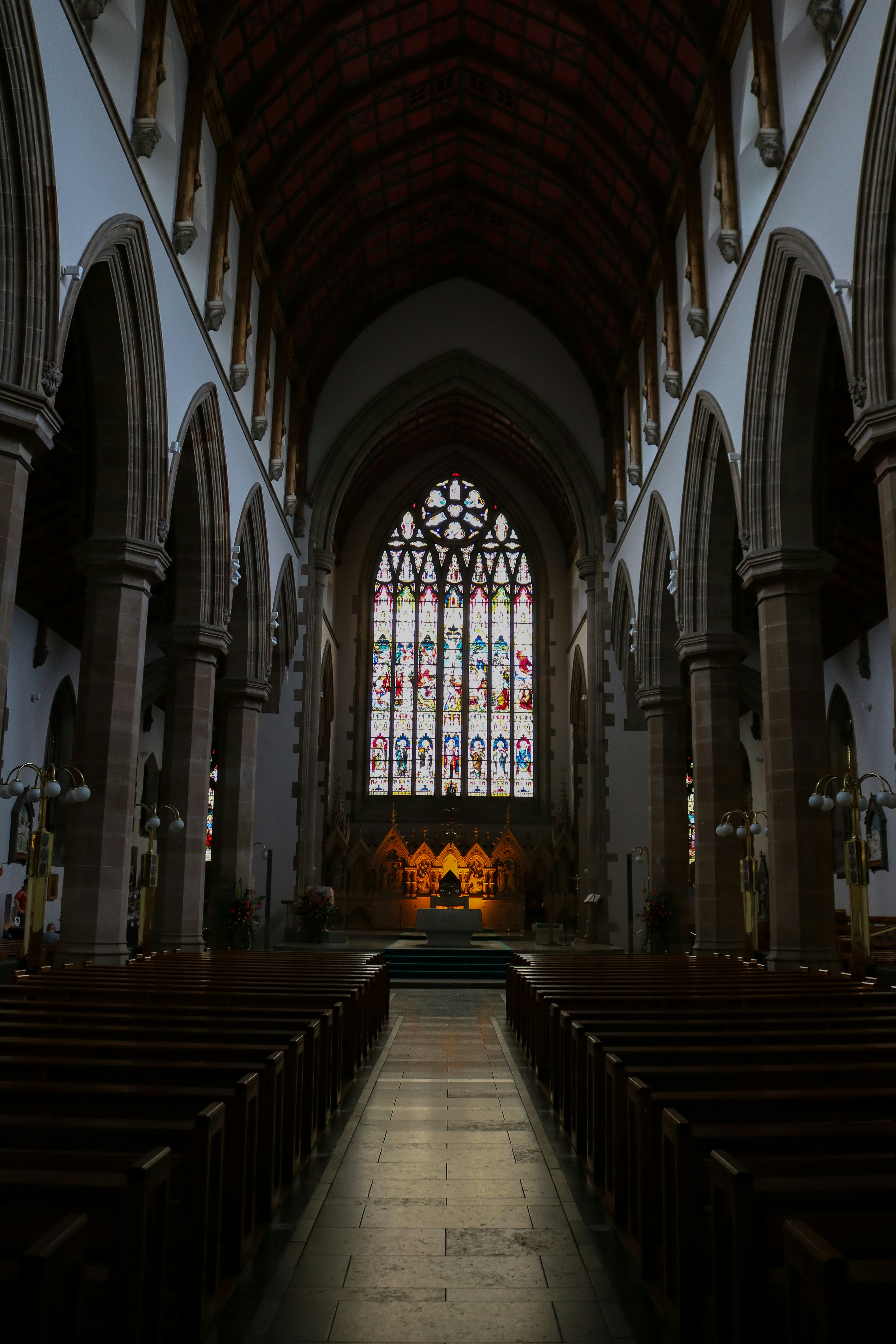 Stained-Glass Cathedral Aisle: Light Through Arches