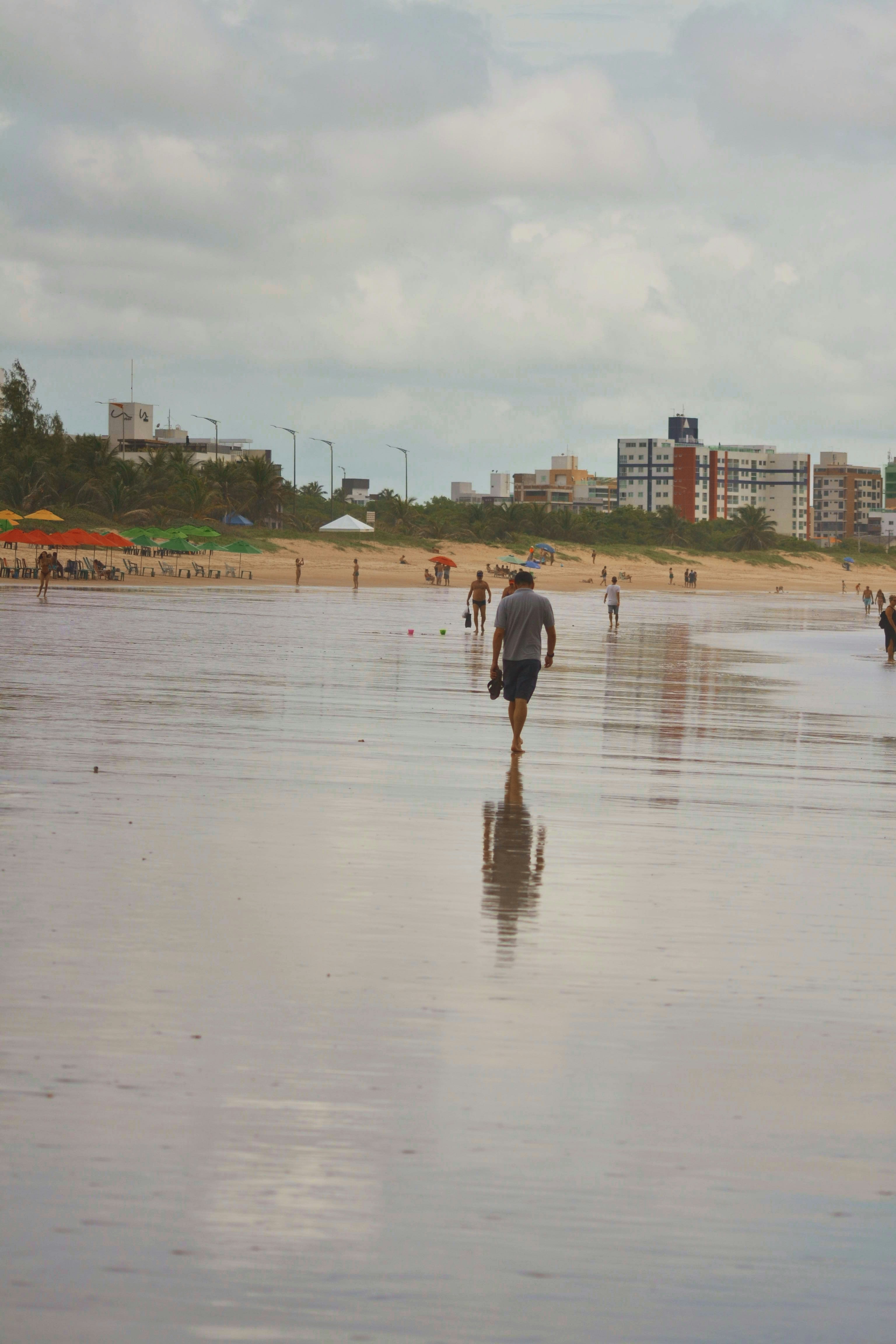 Solitary Walker on the Tidal Mirror
