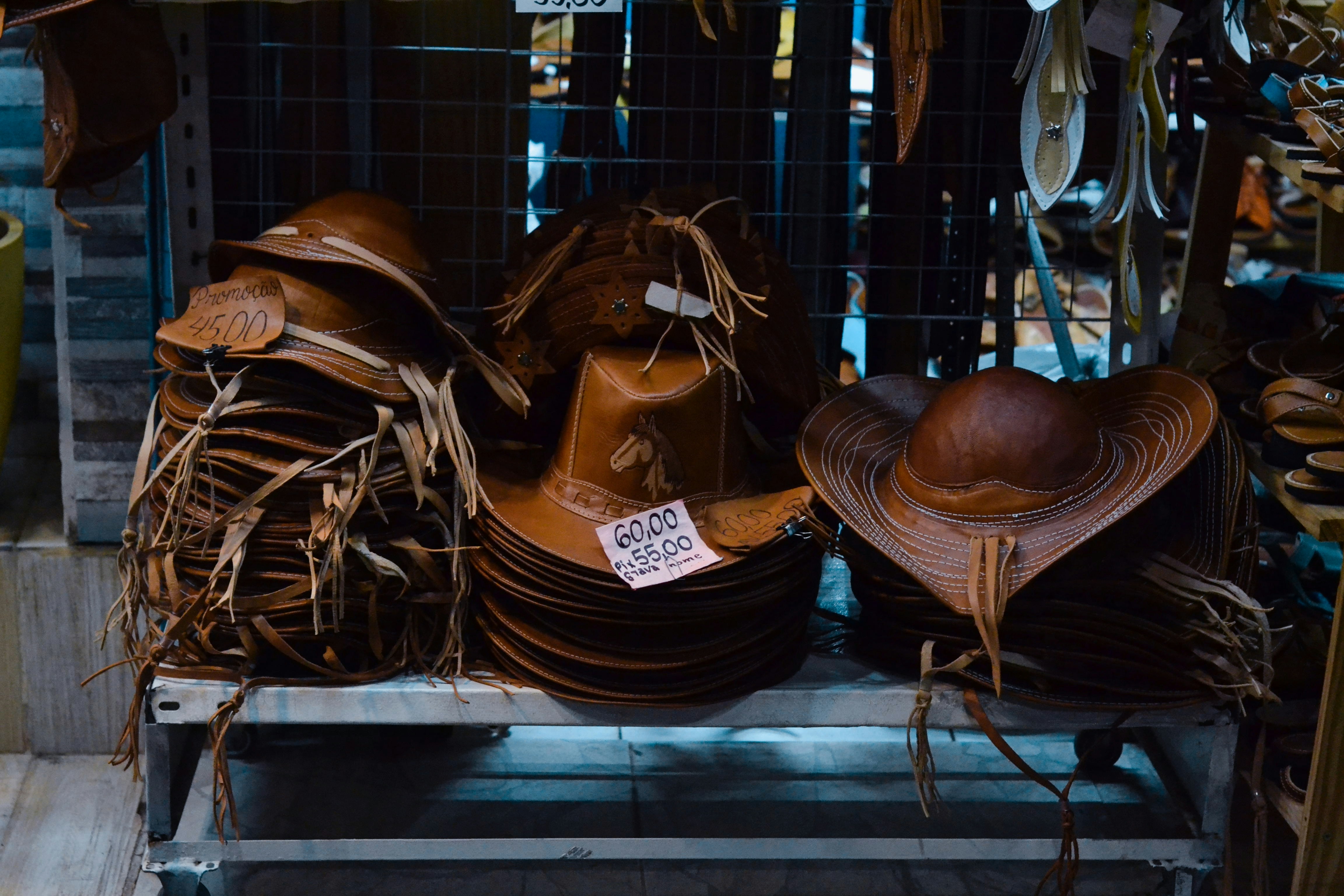 Pastel Straw: A Row of Weathered Hats in a Market Stall