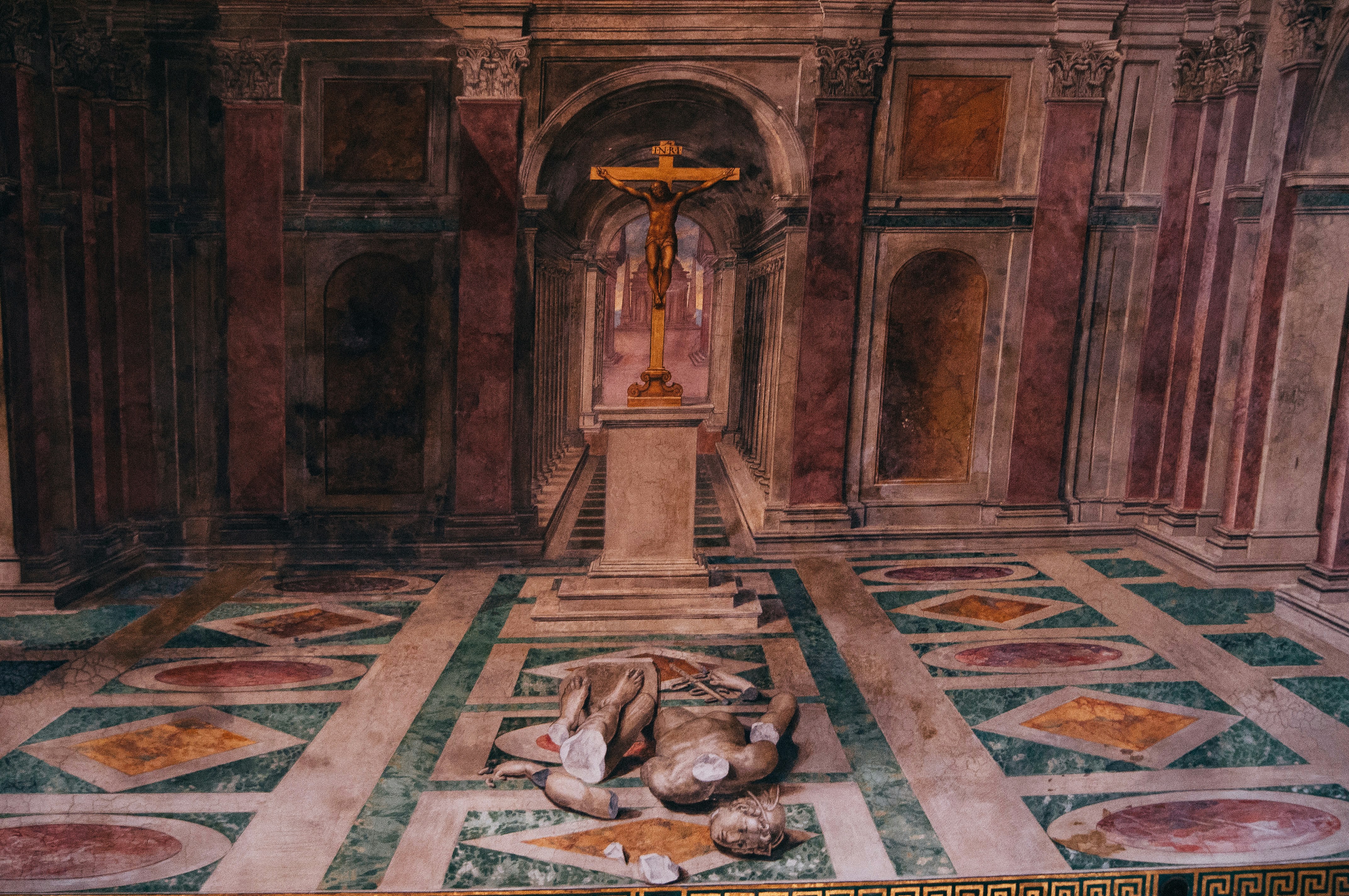 Cruciform Stillness: Bodies in a Marble Chapel