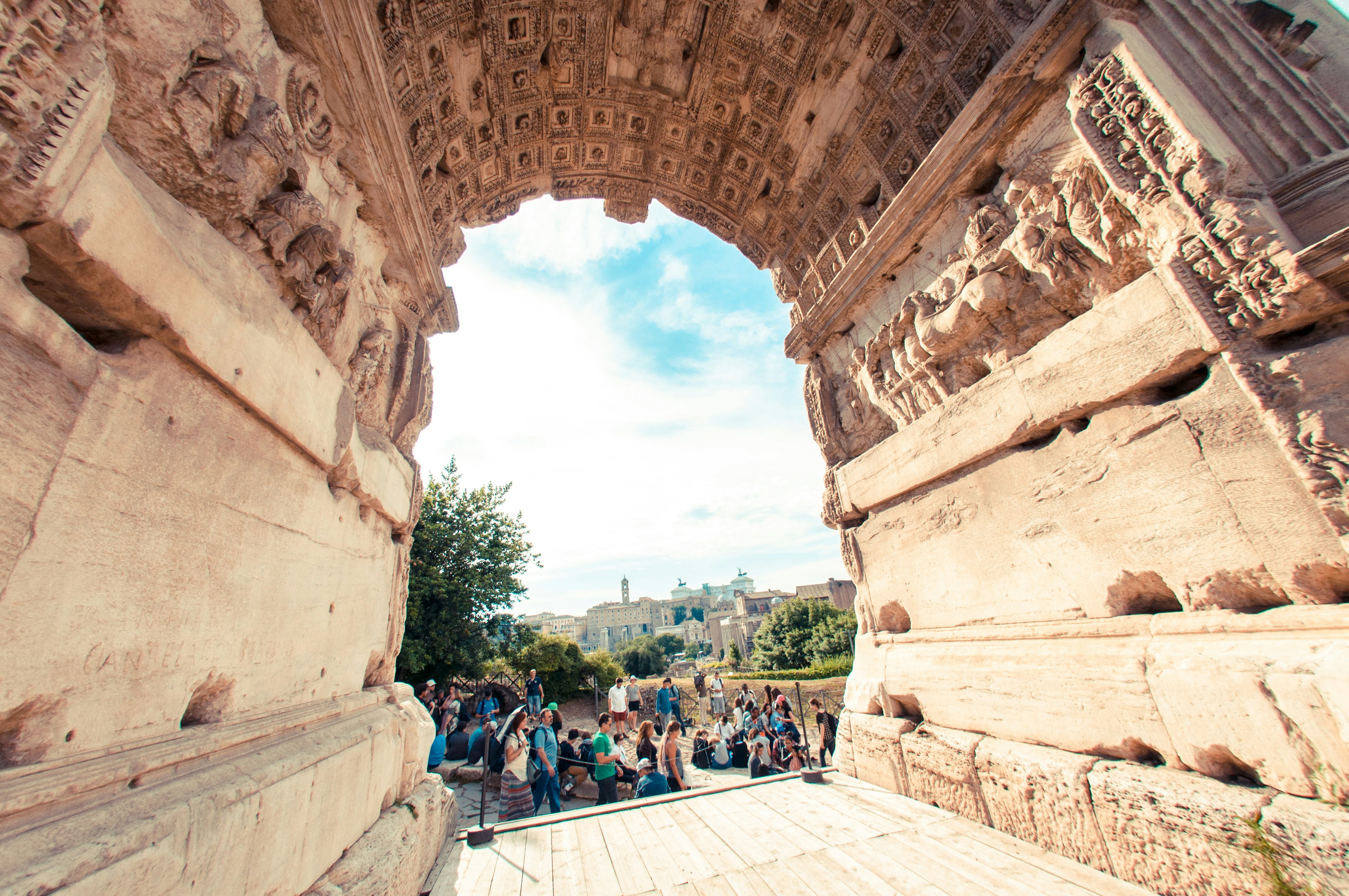 Light at the Threshold: People Gather Beneath an Ancient Arch