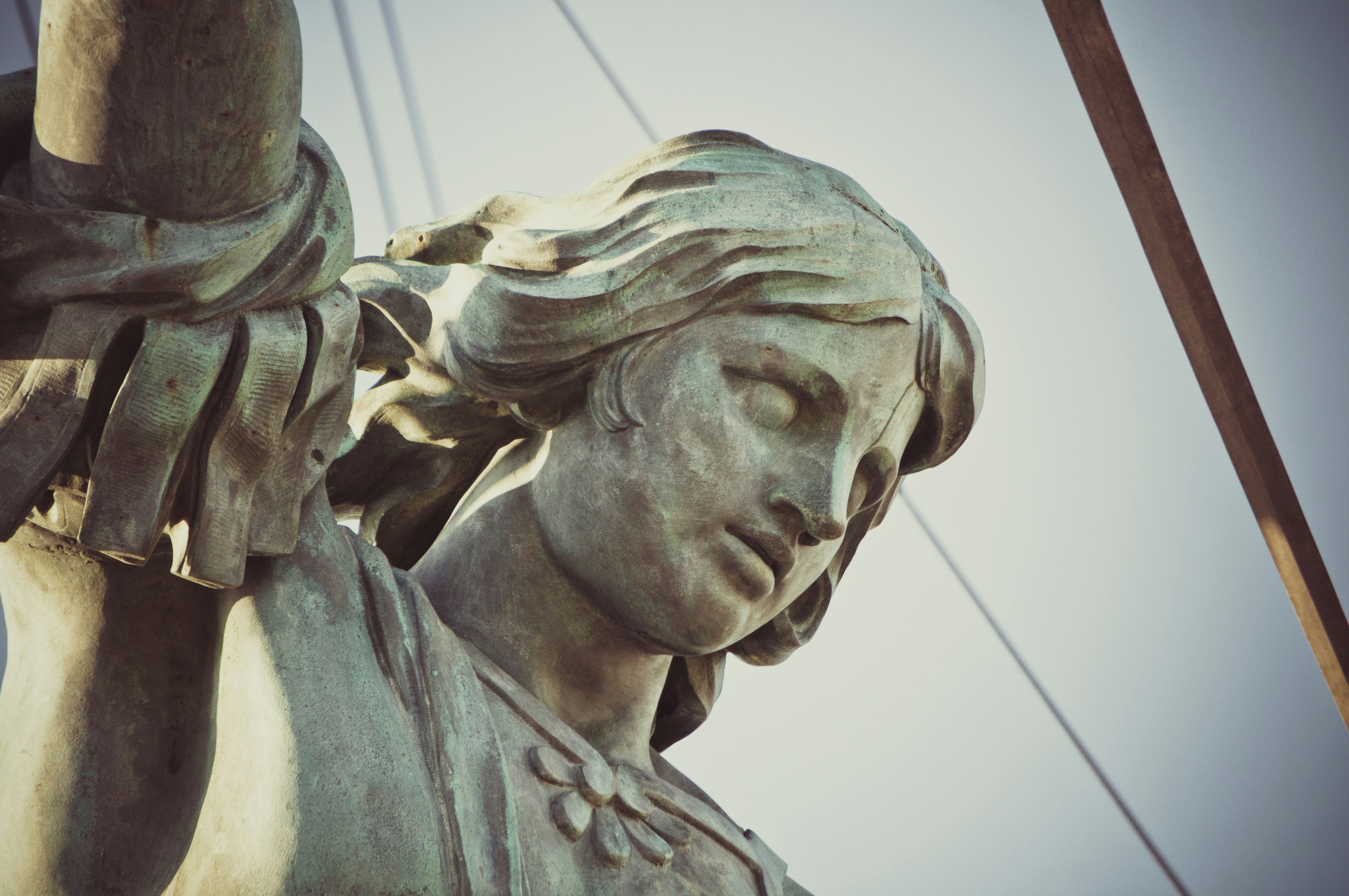 Weighing the Wind: A Weathered Gaze on a Stone Figure