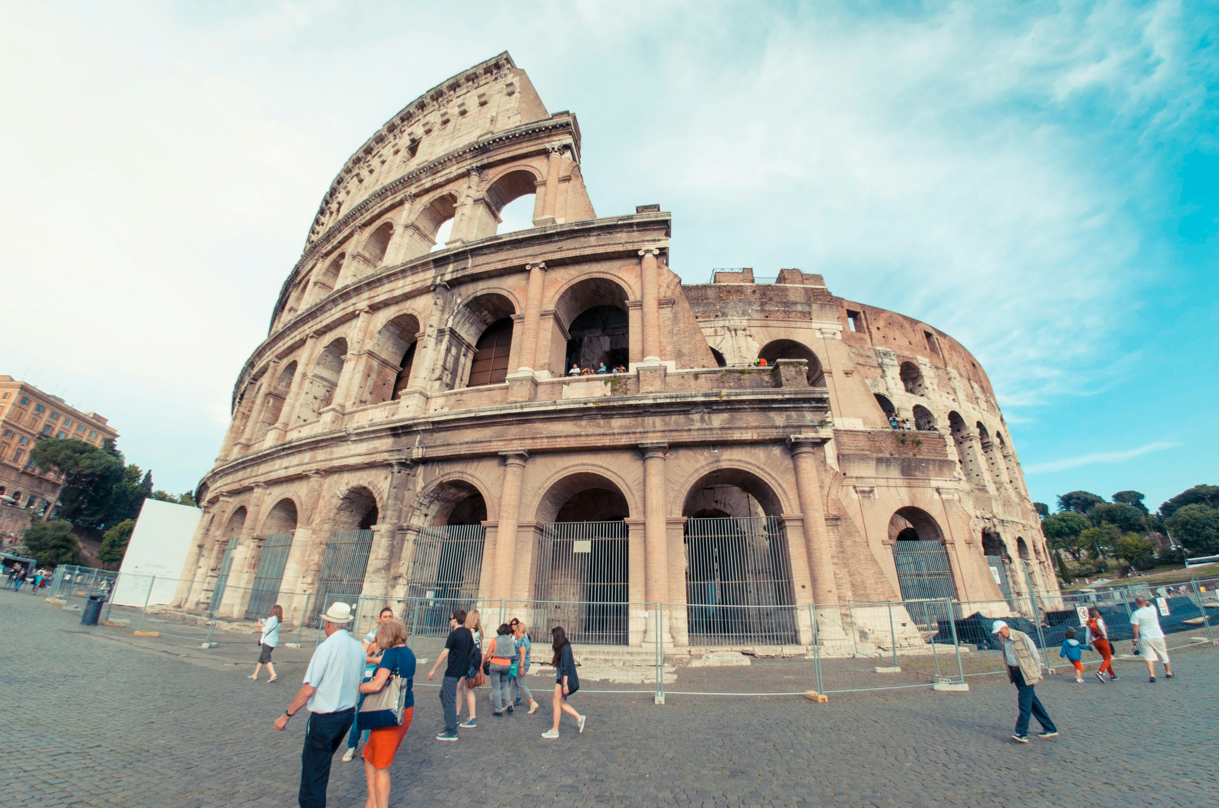 Colosseum in Motion: Tourists Traverse an Ancient Arc