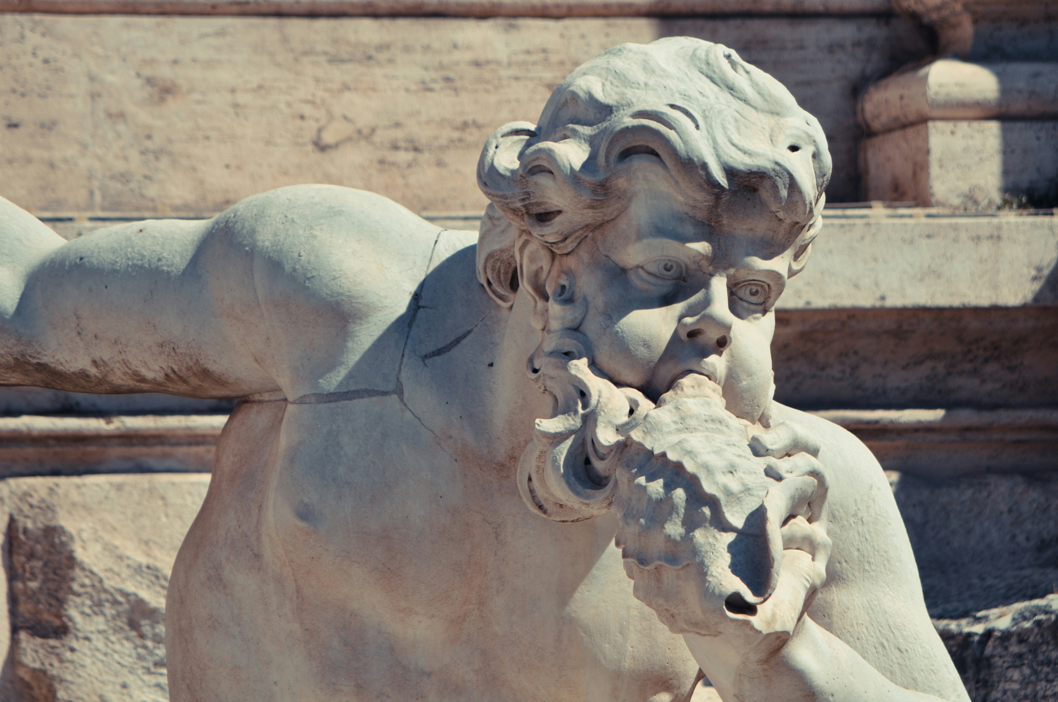 Stone Statue in Focus: A Mythic Bearded Figure at the Steps