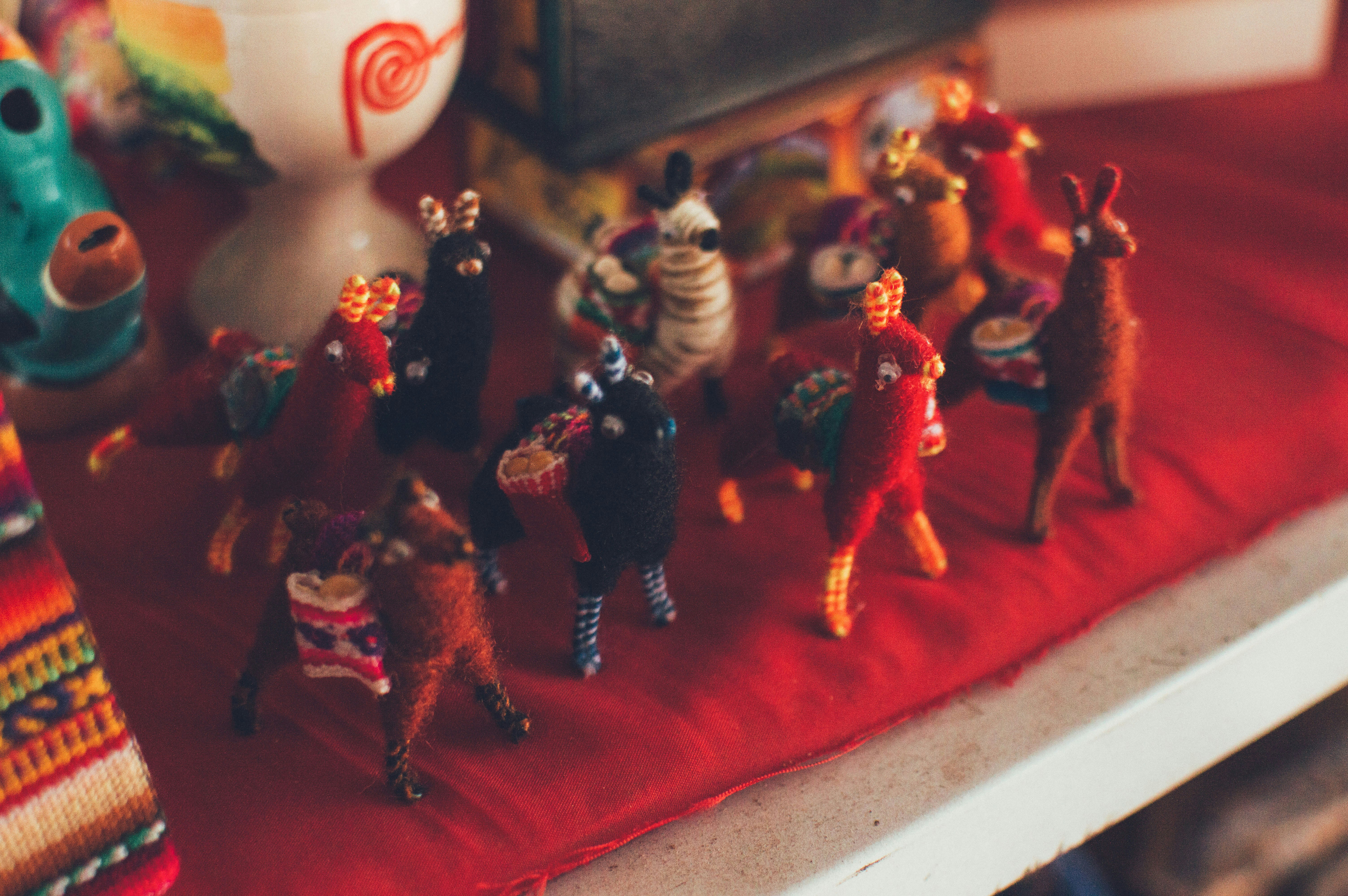 Miniature Toy Town on a Red Tabletop