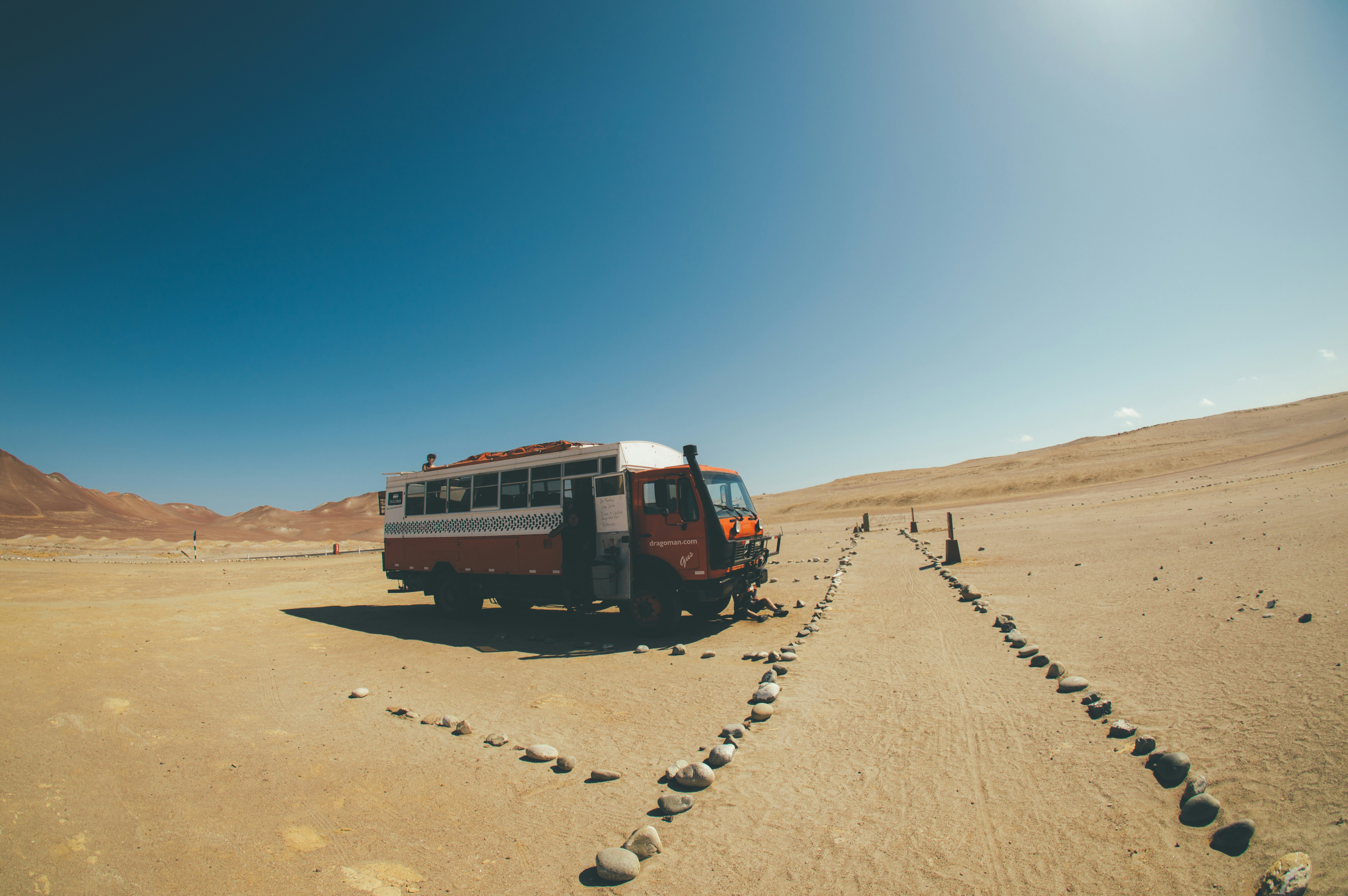 Desert Bus Route Under Wide-Open Sky