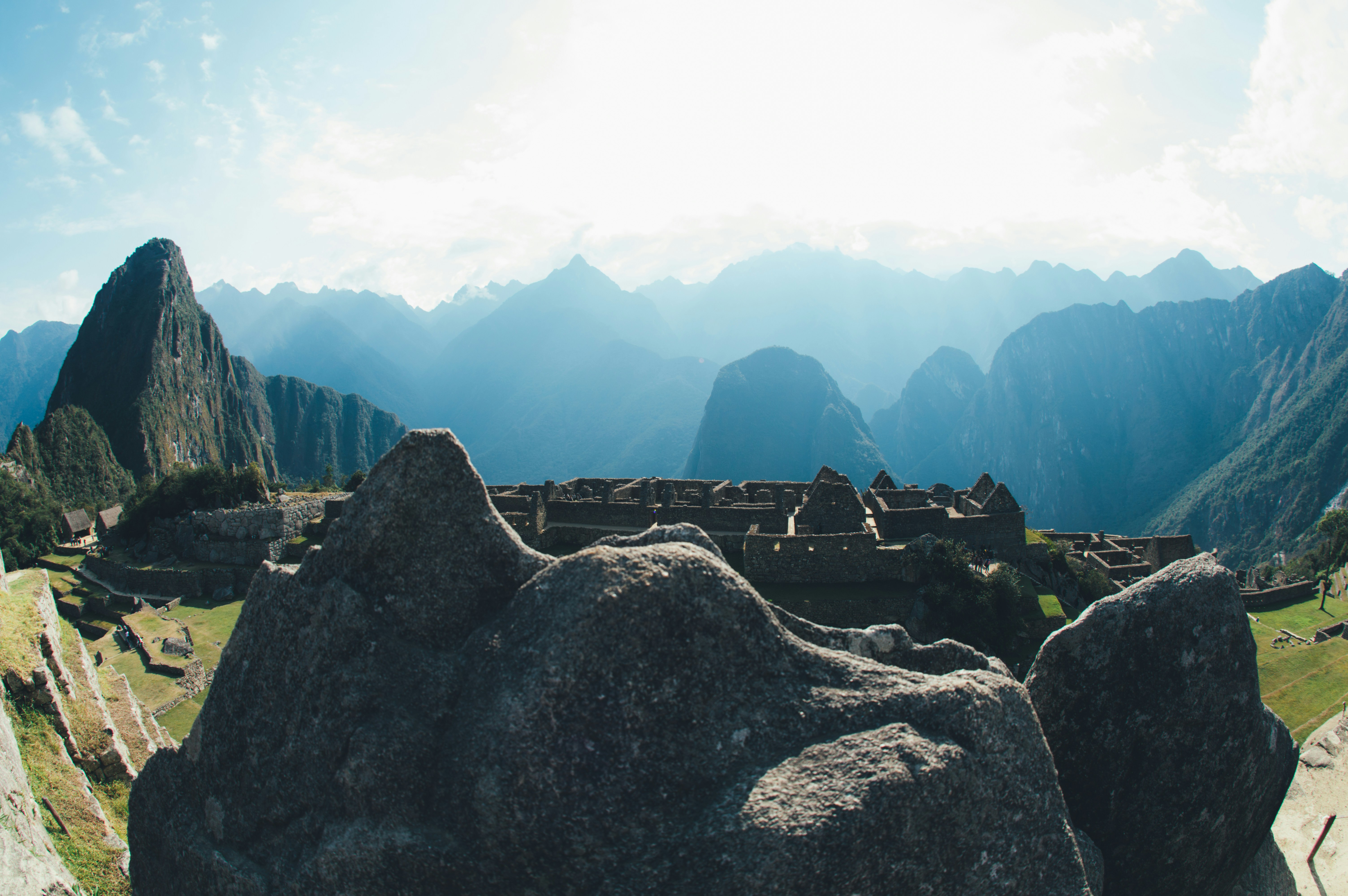 Stone Sentinels at Machu Picchu Ridge: Sunlit Terraces Against a Layered Valley